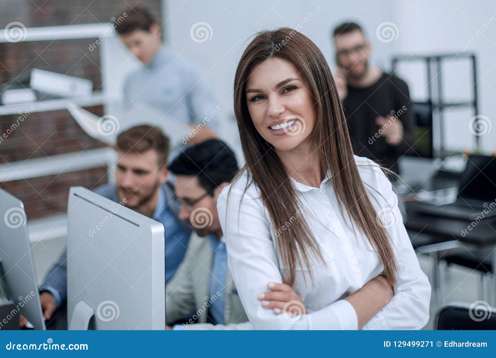 Young Employee on the Background of the Office Stock Image - Image of ...
