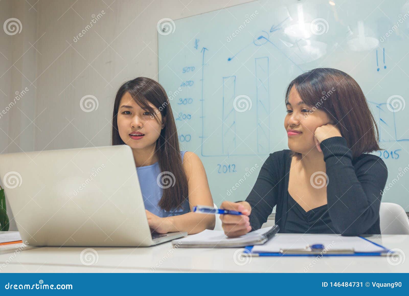 Young Employee Discuss about Work on Laptop Stock Image - Image of ...