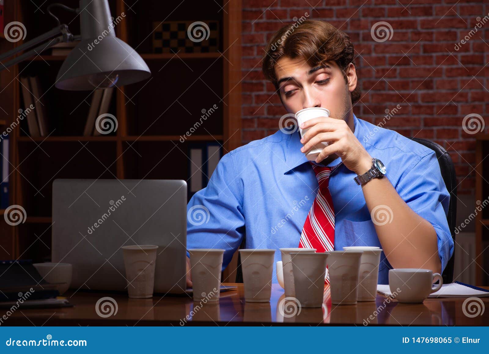 The Young Employee Drinking Coffee Working at Night Shift Stock Image ...