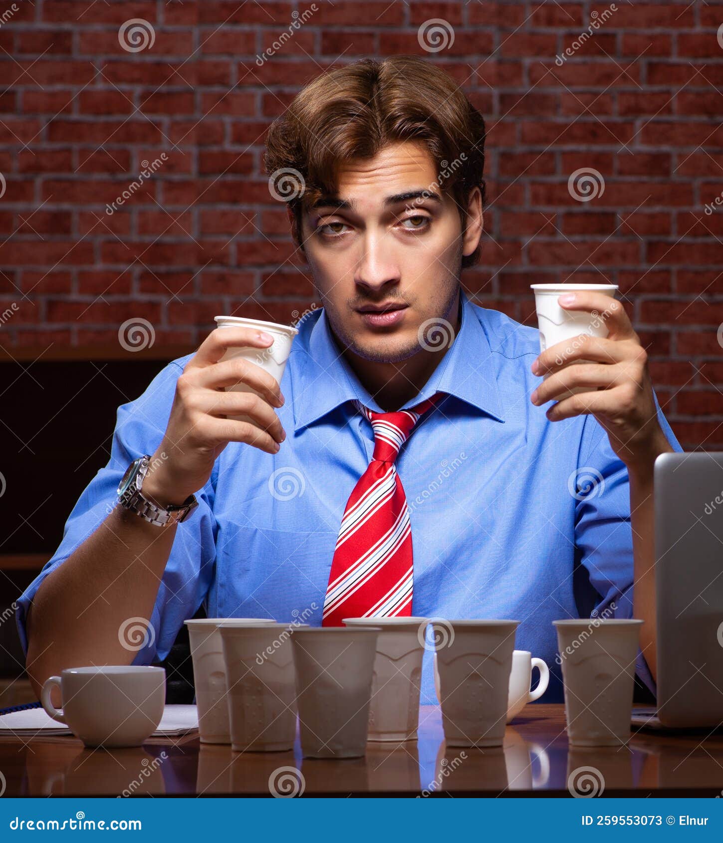 The Young Employee Drinking Coffee Working at Night Shift Stock Image ...