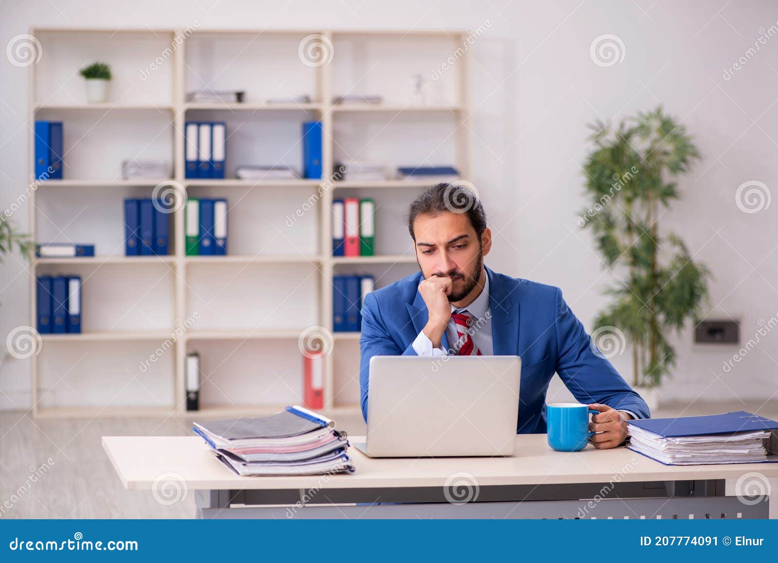 Young Male Employee Drinking Coffee at Workplace Stock Image - Image of ...