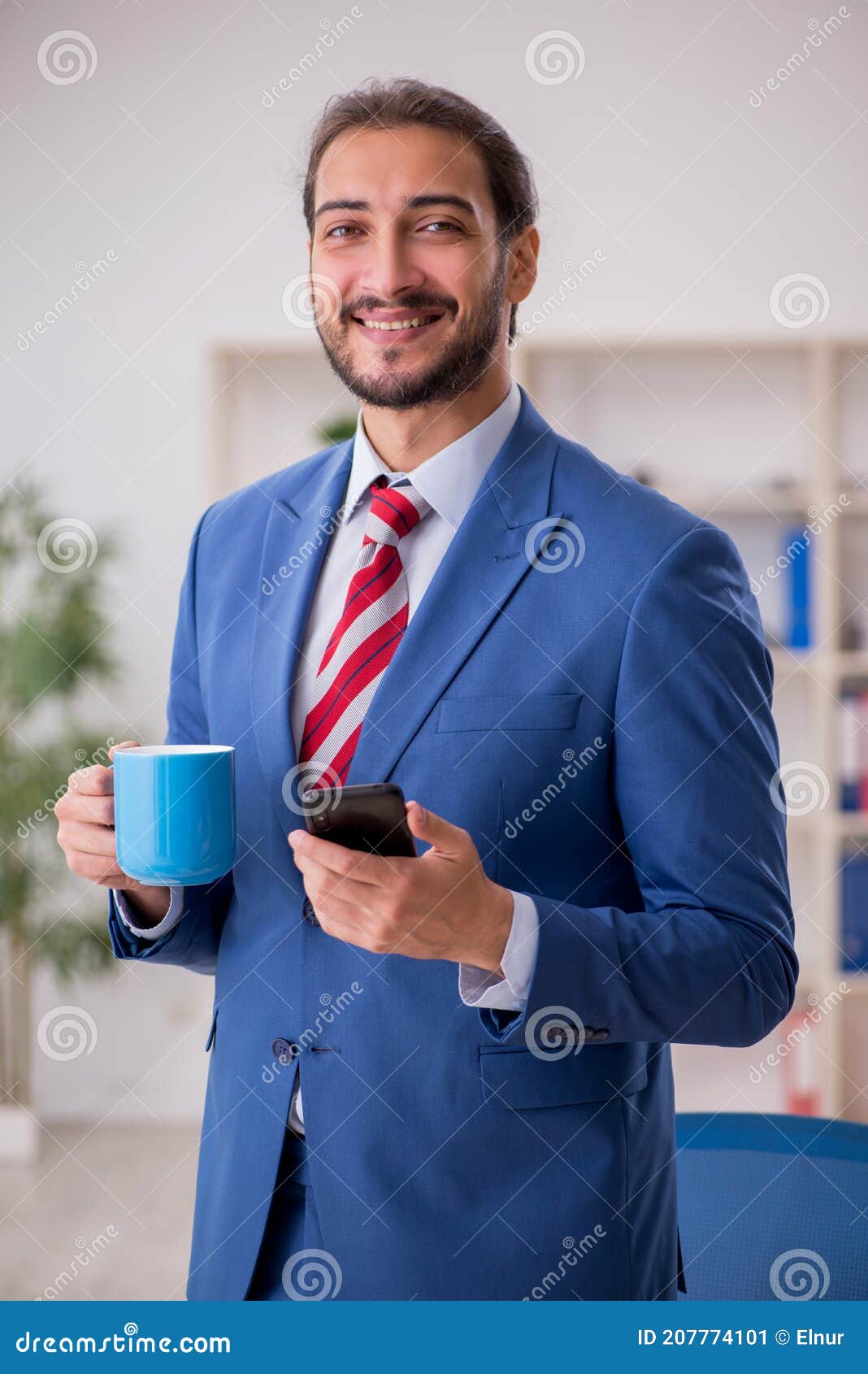 Young Male Employee Drinking Coffee at Workplace Stock Image - Image of ...
