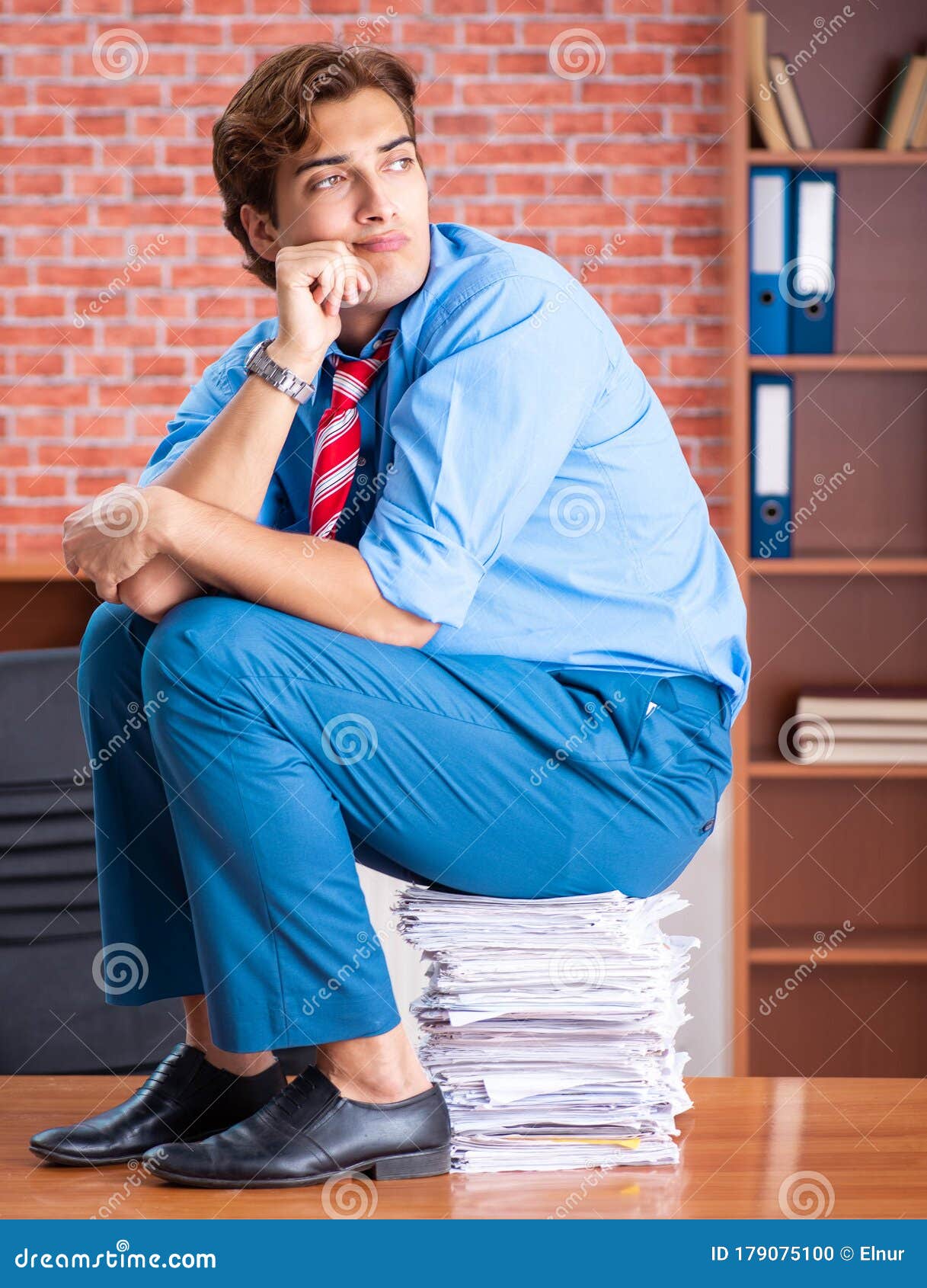 Young Employee with Excessive Work Sitting at the Office Stock Photo ...