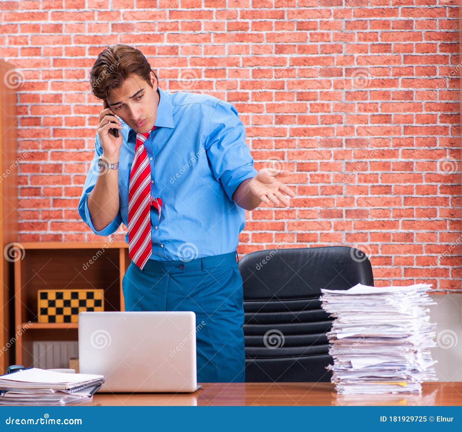 Young Employee with Excessive Work Sitting at the Office Stock Image ...