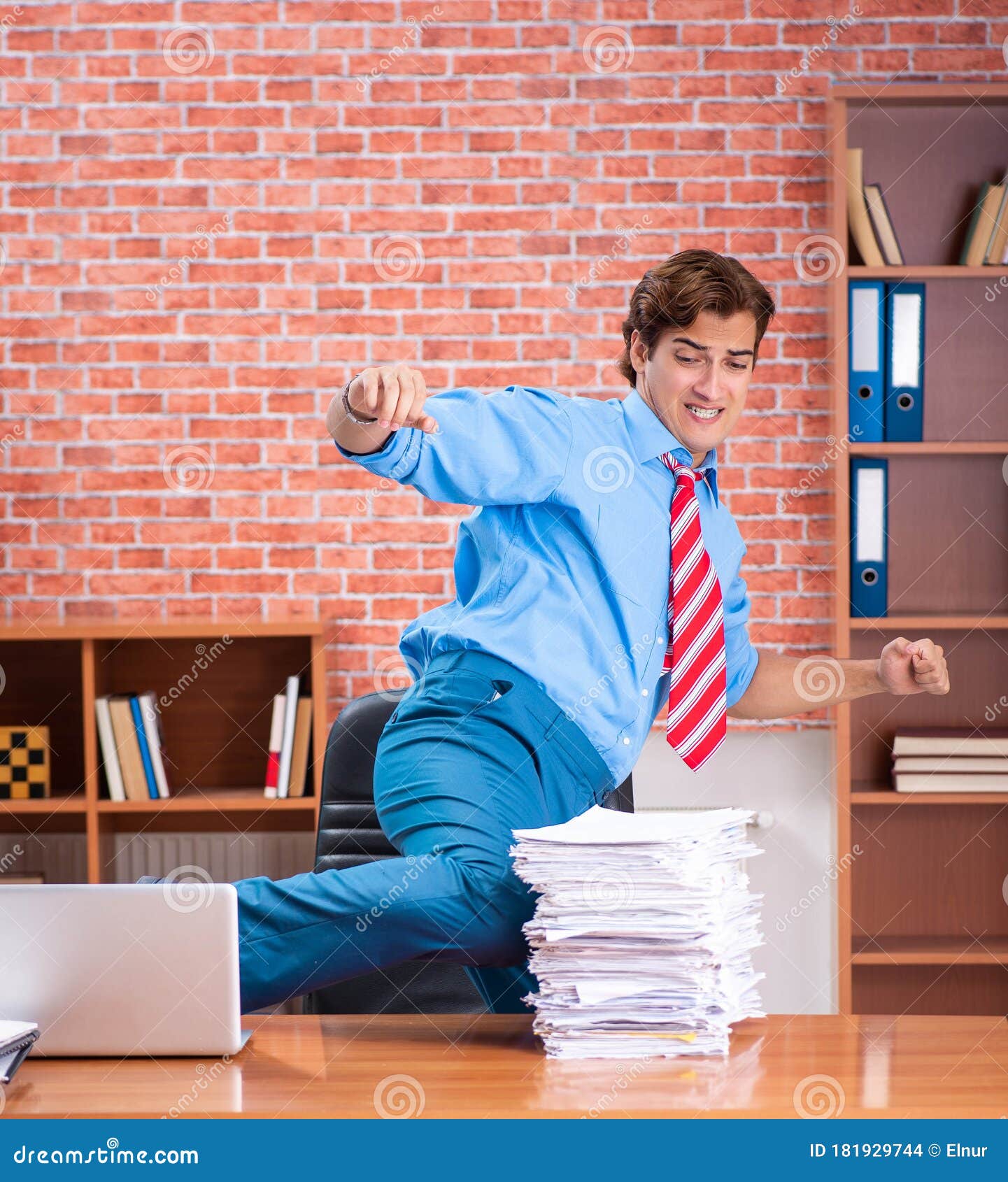 Young Employee with Excessive Work Sitting at the Office Stock Photo ...