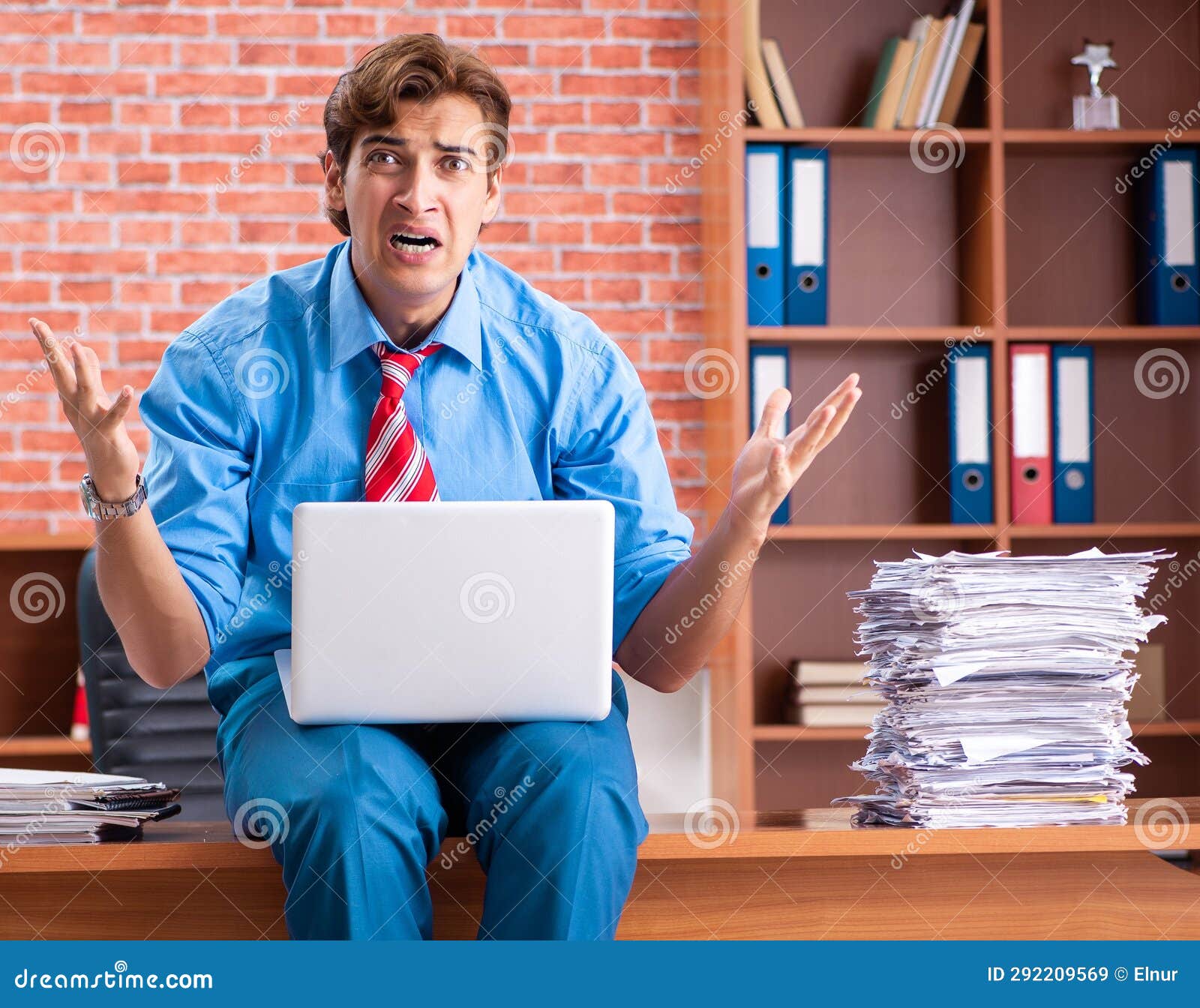 Young Employee with Excessive Work Sitting at the Office Stock Image ...