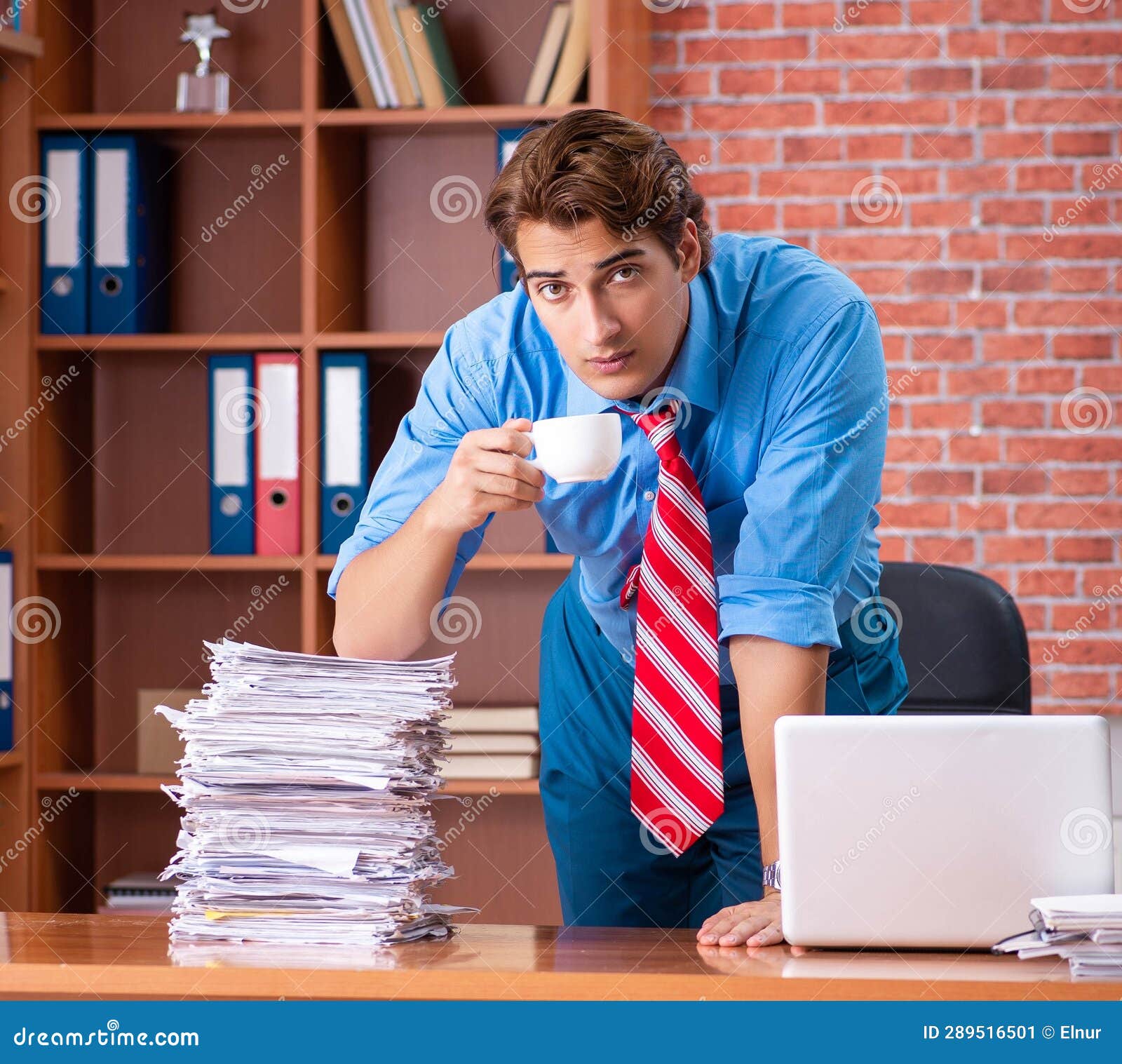 Young Employee with Excessive Work Sitting at the Office Stock Image ...