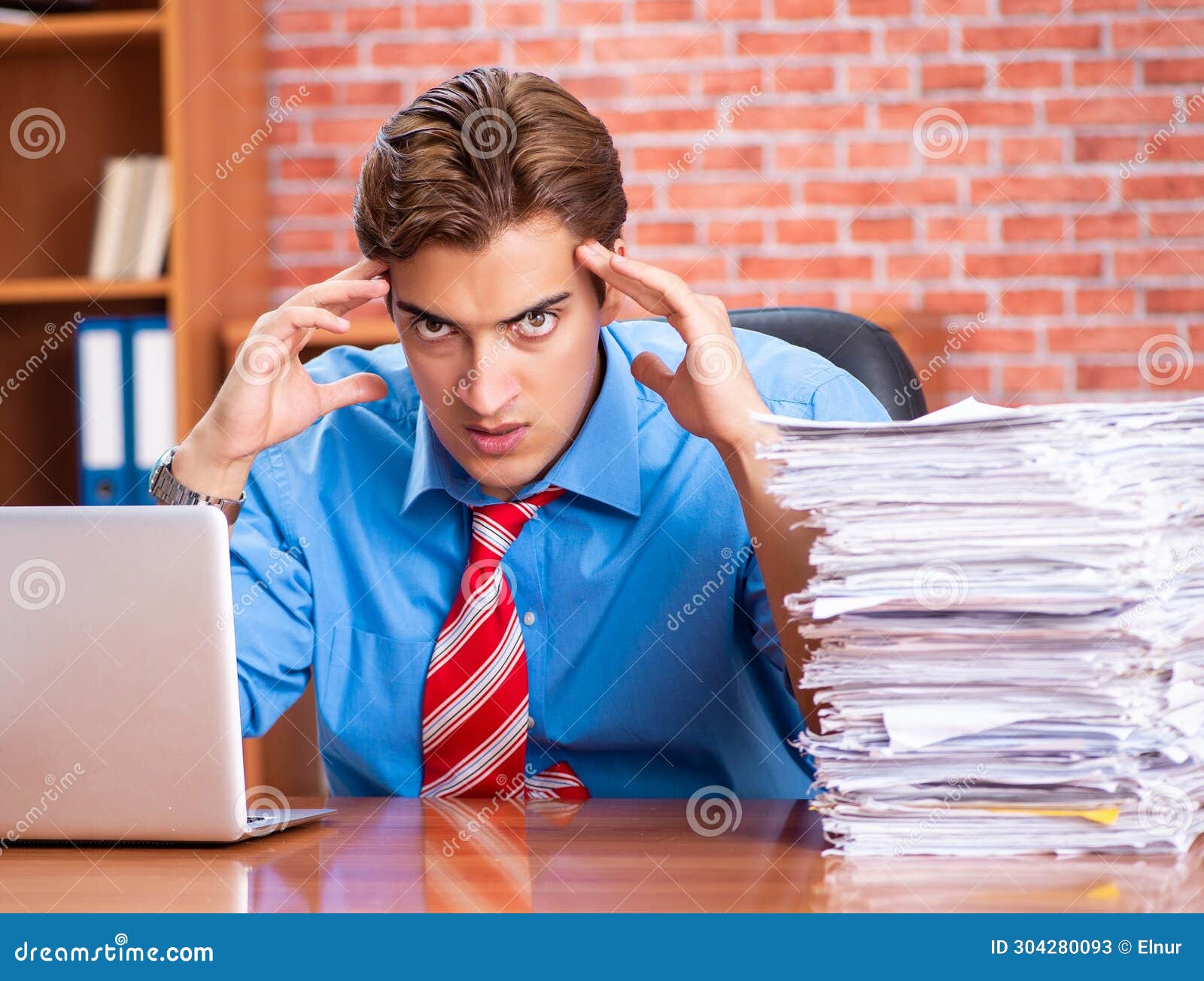 Young Employee with Excessive Work Sitting at the Office Stock Image ...