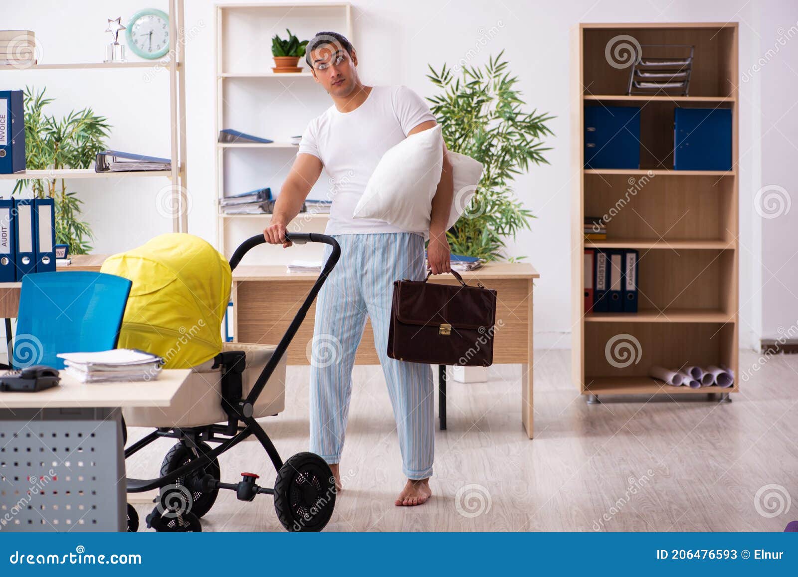 Young Male Employee Looking after Newborn at Workplace Stock Image ...