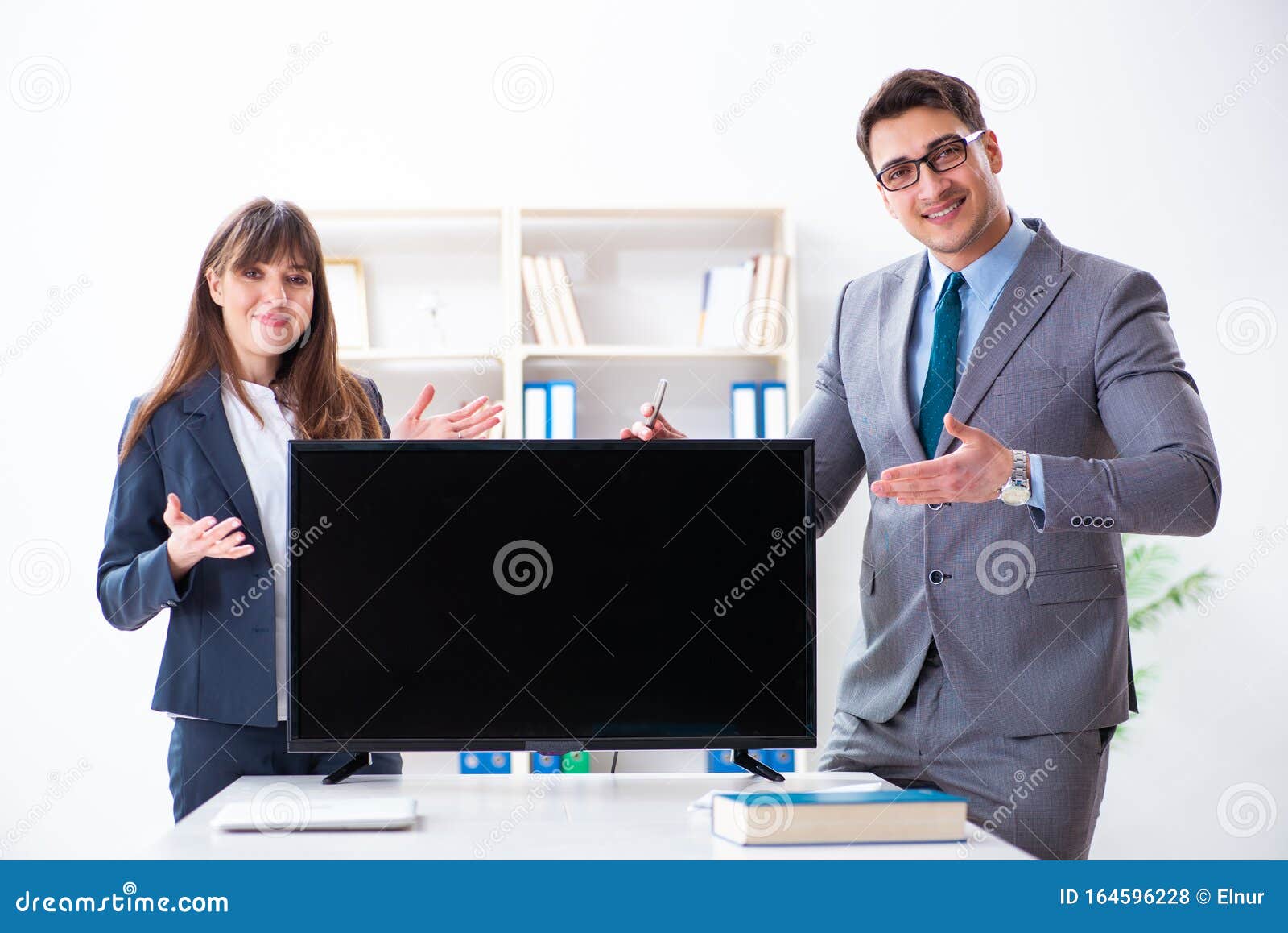 Young Employee Making Presentation To His Female Boss Stock Photo ...