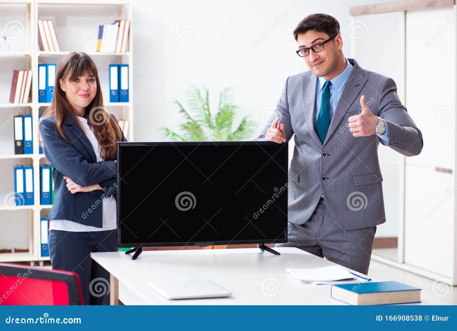 Young Employee Making Presentation To His Female Boss Stock Photo ...