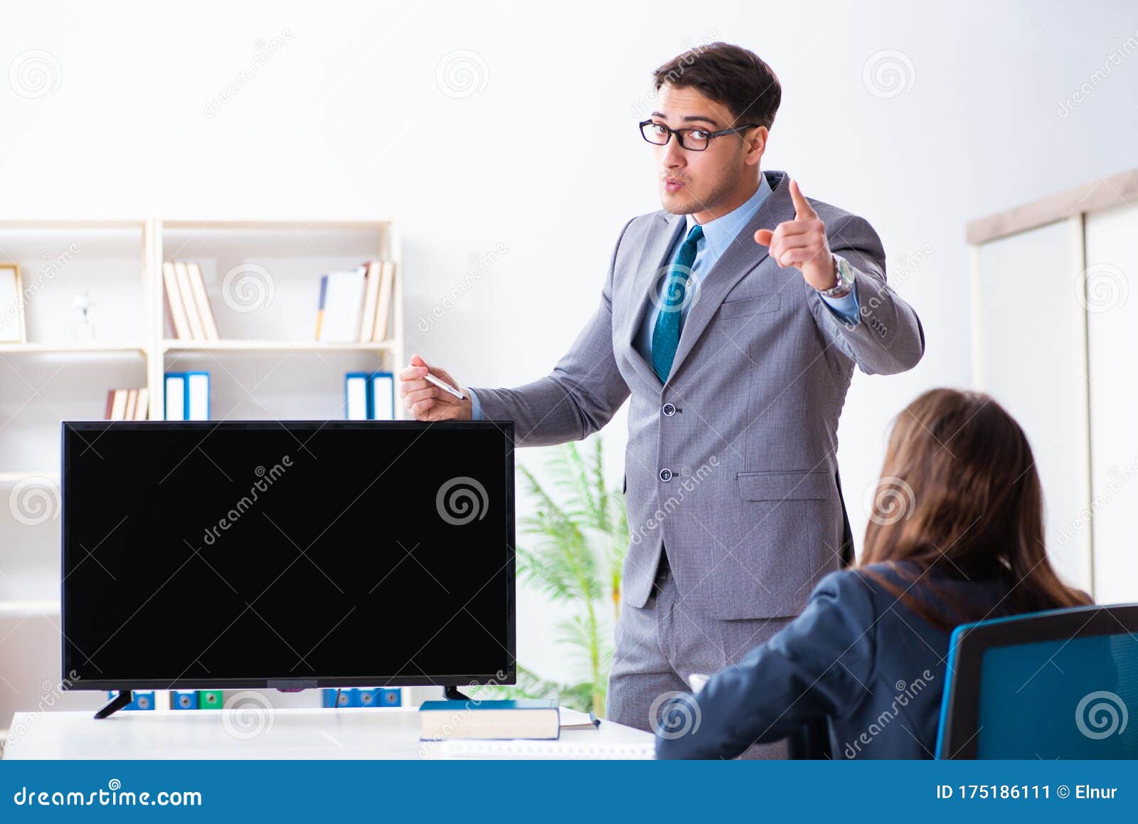 Young Employee Making Presentation To His Female Boss Stock Image ...