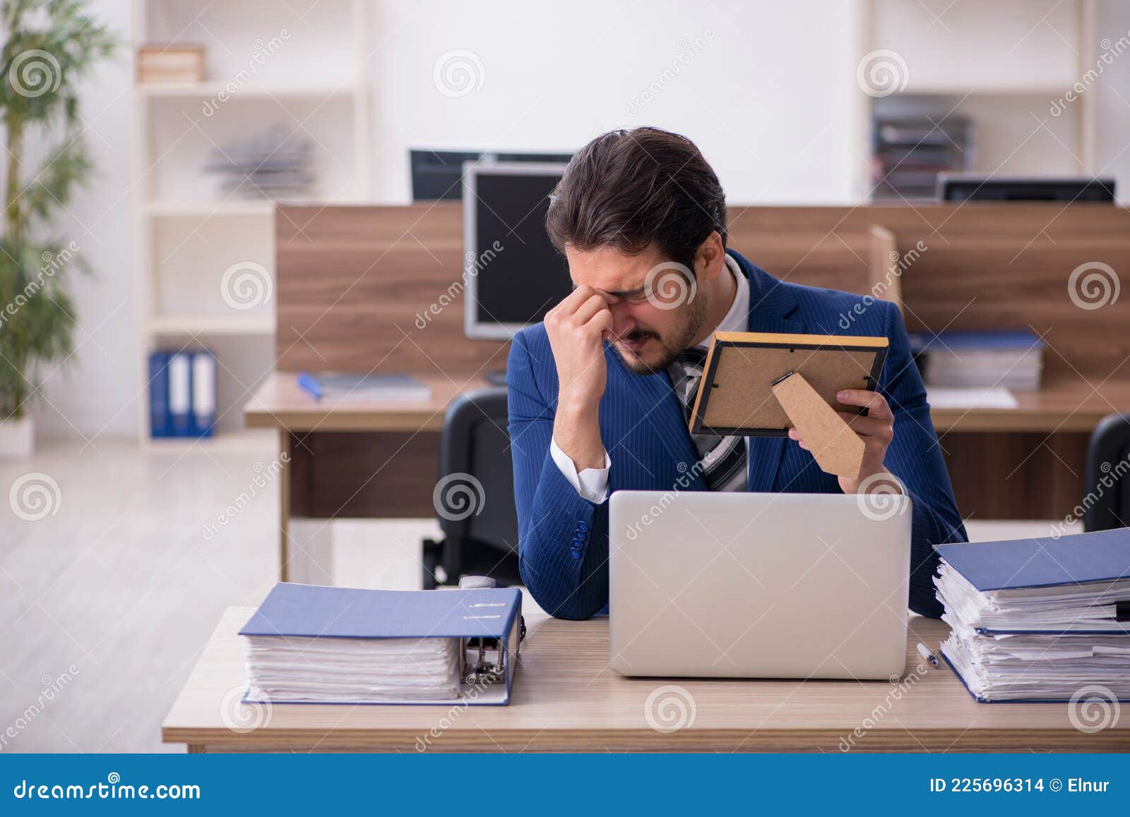 Young Male Employee Missing Girlfriend at Workplace Stock Photo - Image ...