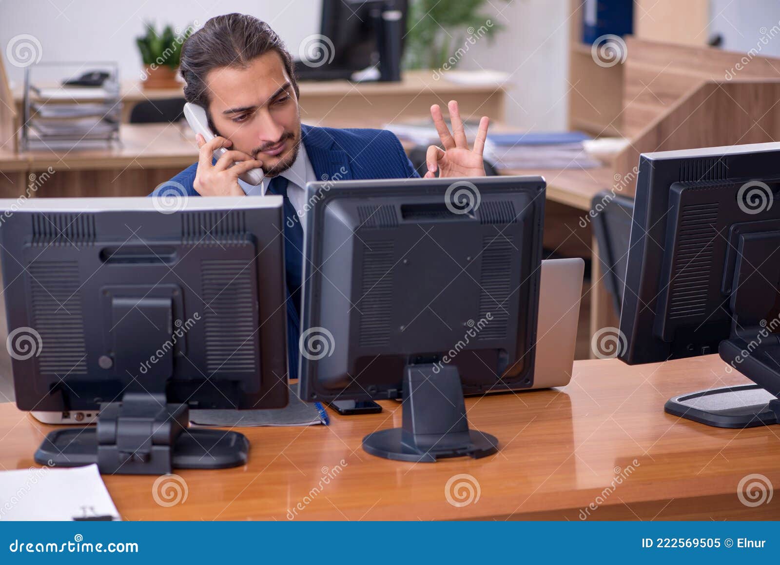 Young Male Employee in Multitasking Concept Stock Image - Image of ...