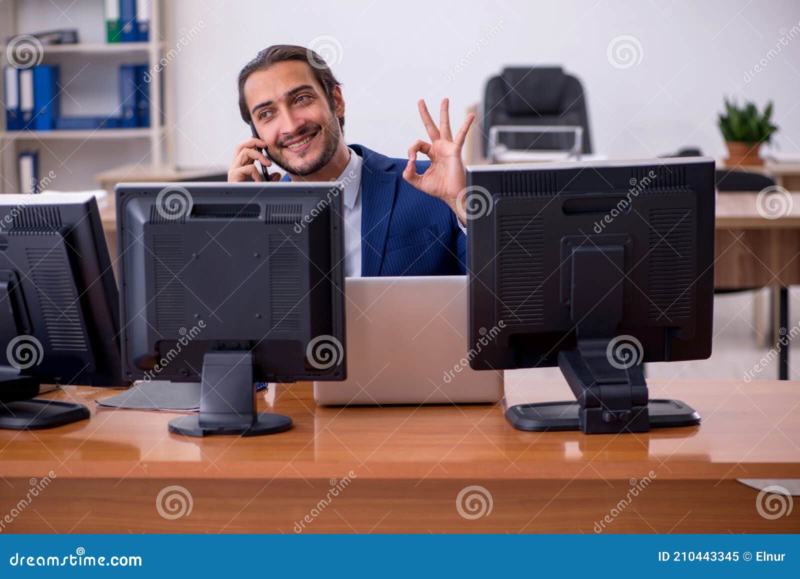 Young Male Employee in Multitasking Concept Stock Image - Image of ...