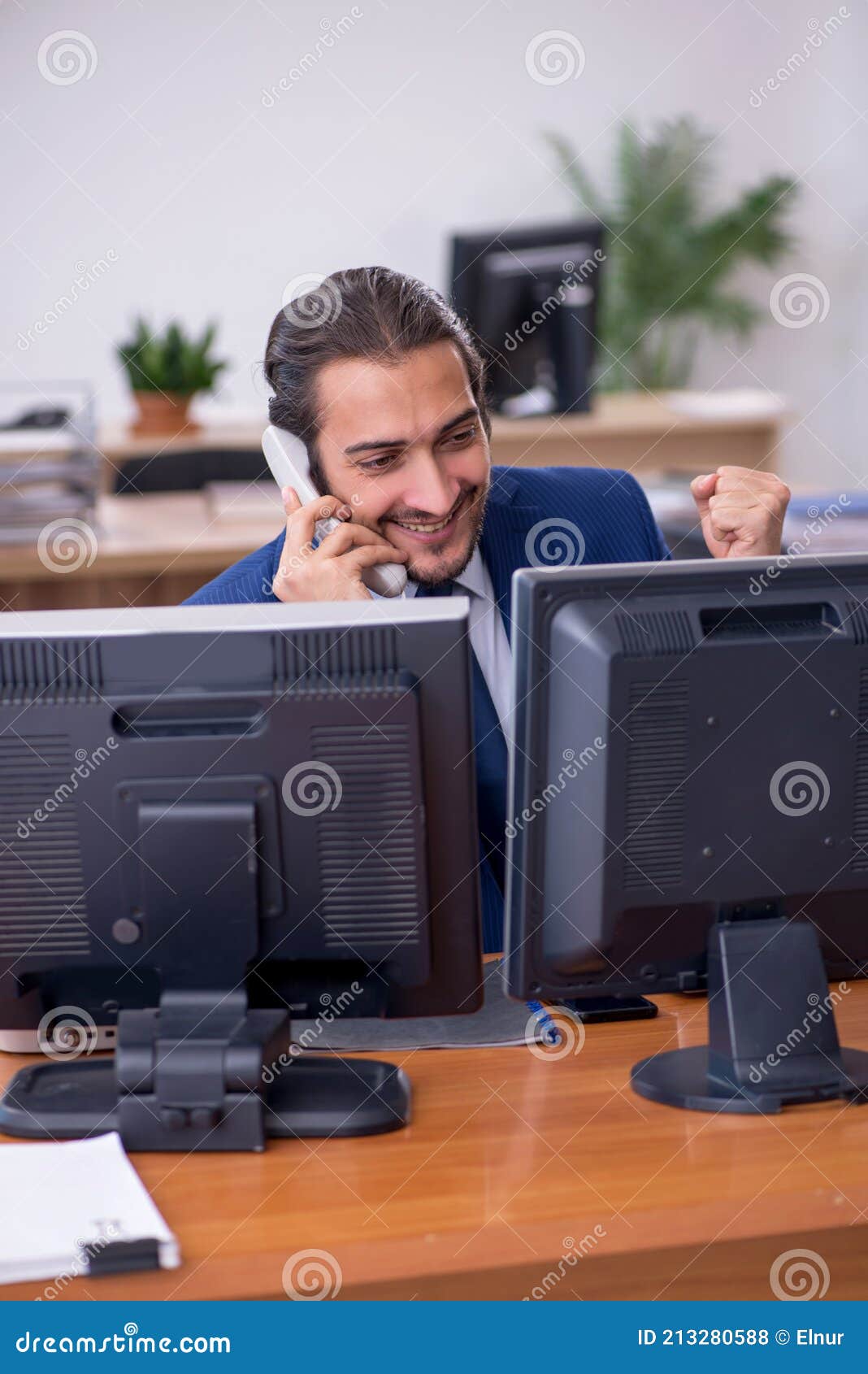 Young Male Employee in Multitasking Concept Stock Photo - Image of ...