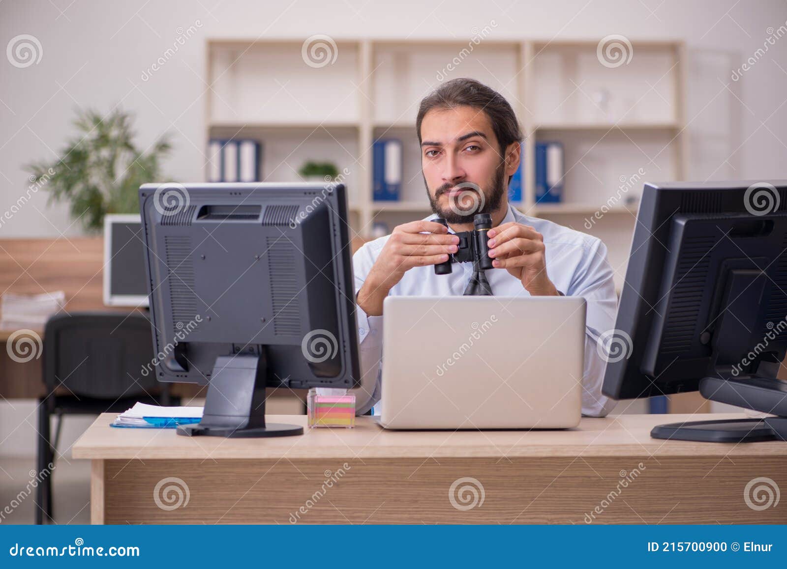 Young Male Employee in Multitasking Concept Stock Photo - Image of ...