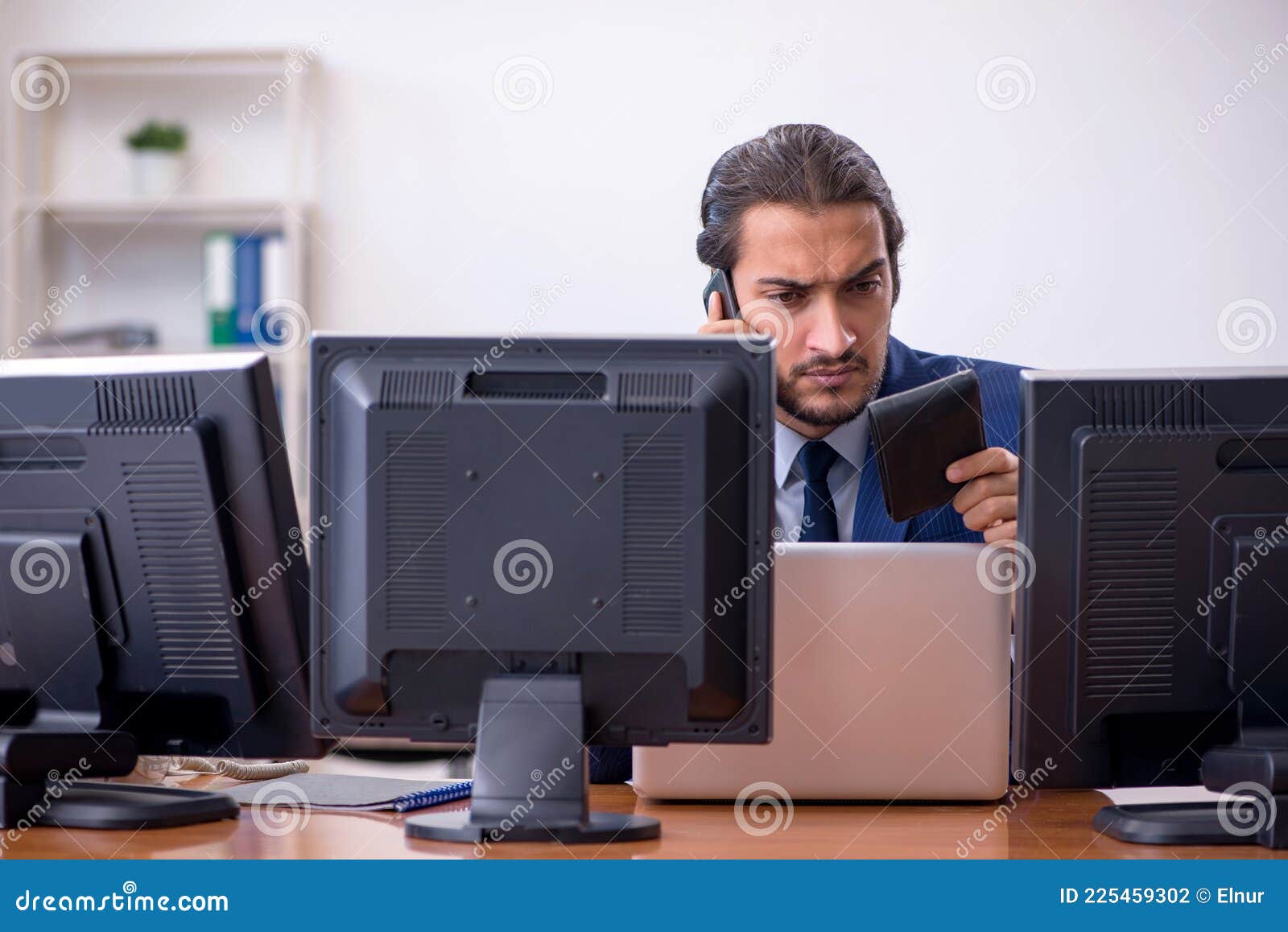 Young Male Employee in Multitasking Concept Stock Photo - Image of ...