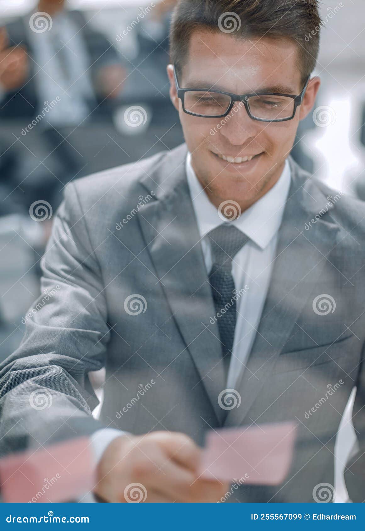 Young Employee Reading a Note on the Glass. Stock Image - Image of wall ...