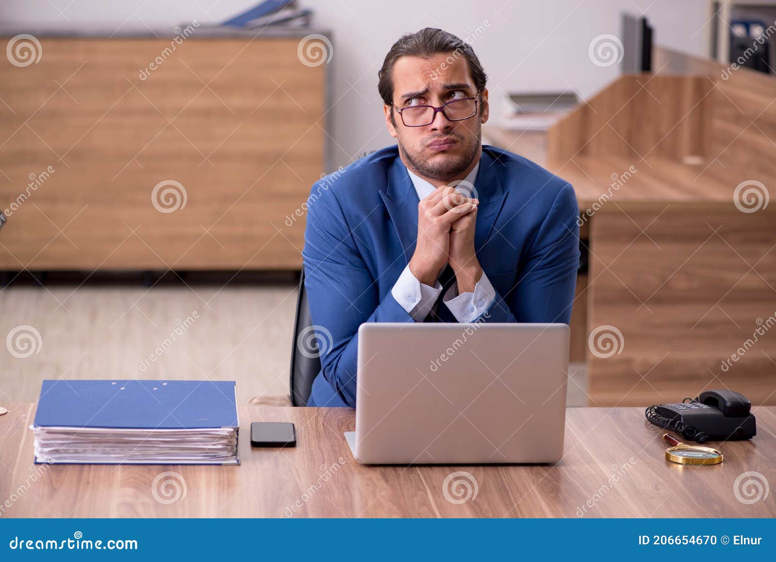 Young Male Employee Sitting at Workplace Stock Photo - Image of ...