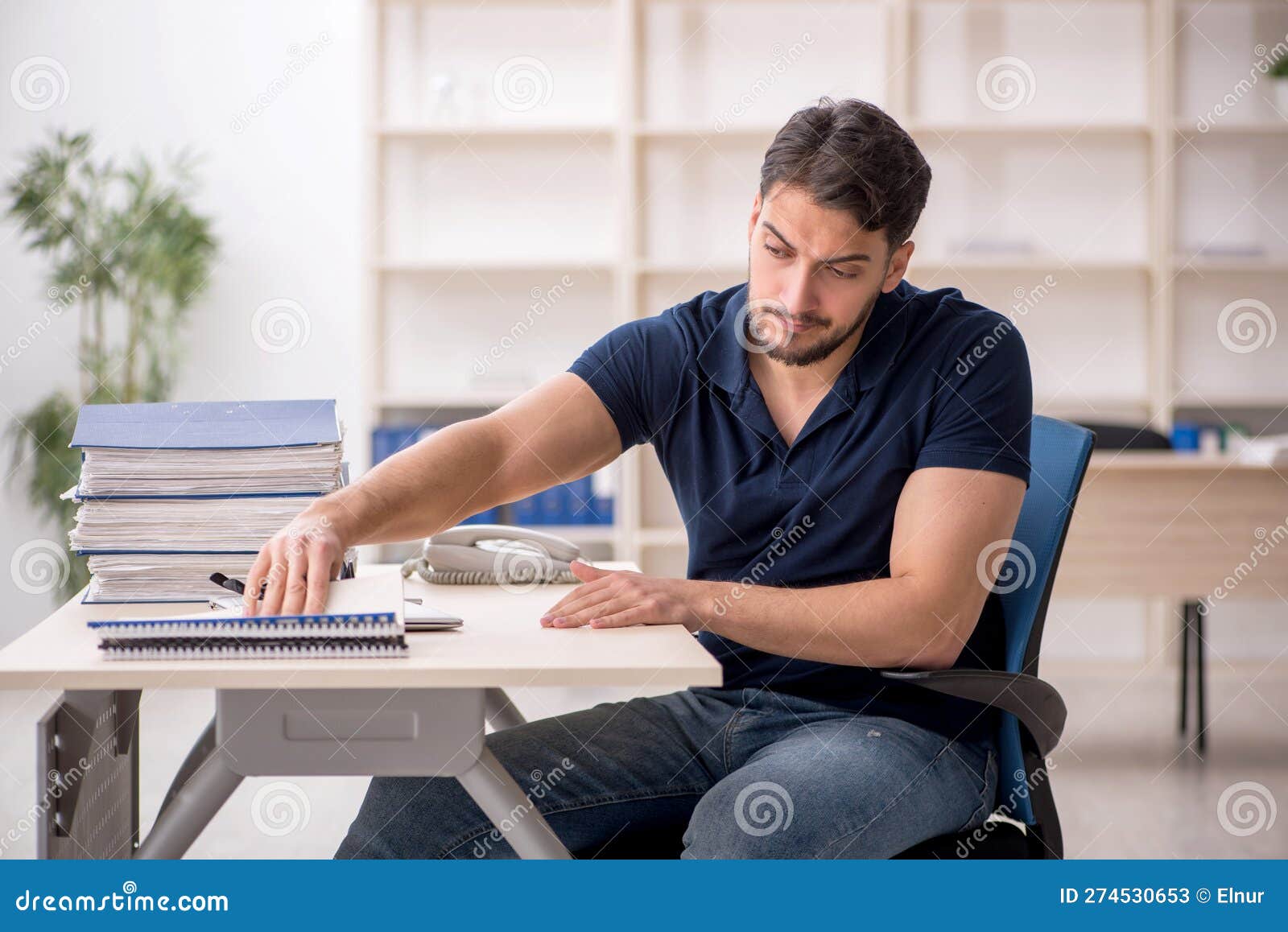 Young Male Employee Sitting at Workplace Stock Image - Image of busy ...