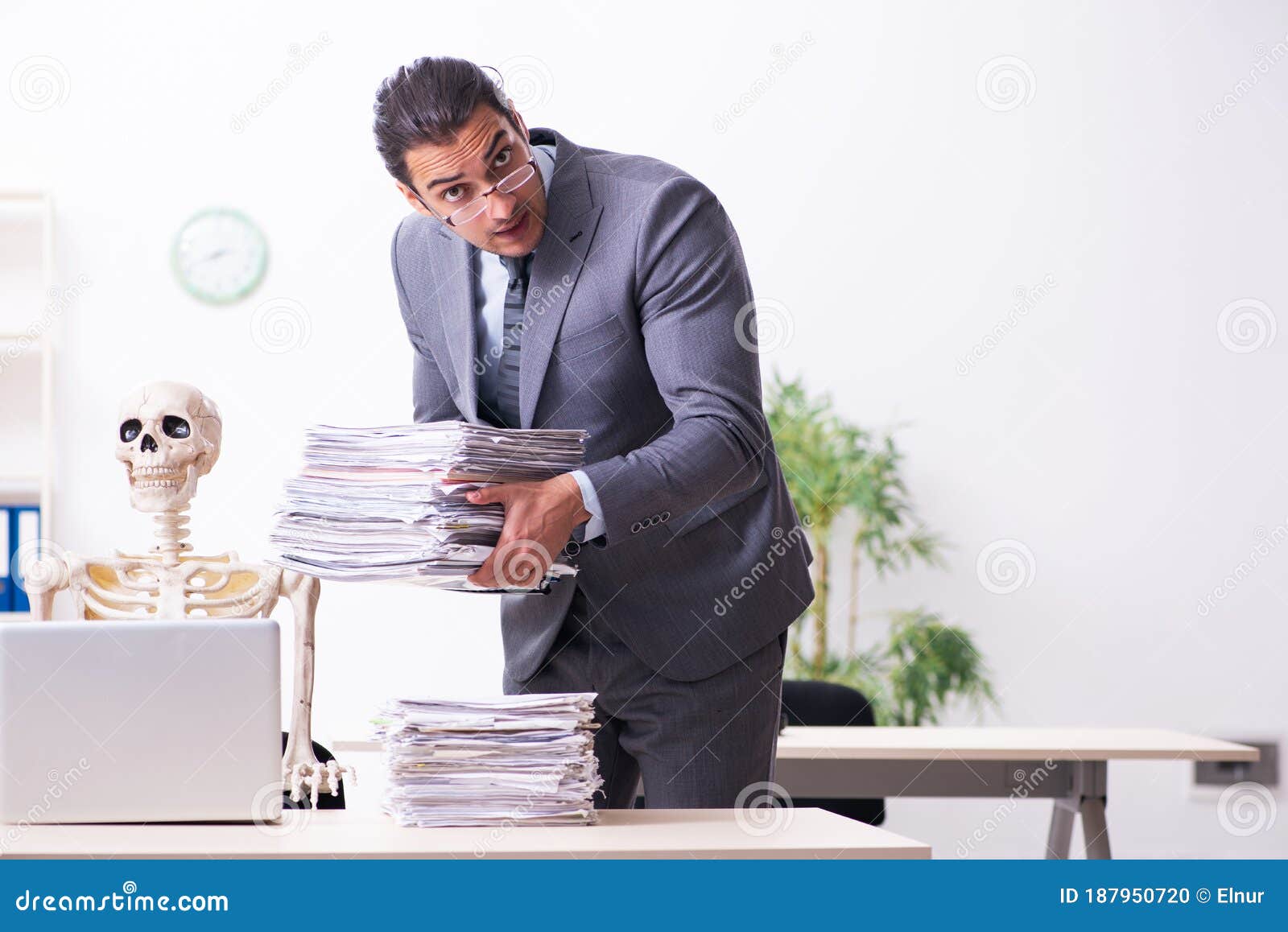 Young Male Employee and Skeleton in the Office Stock Photo - Image of ...