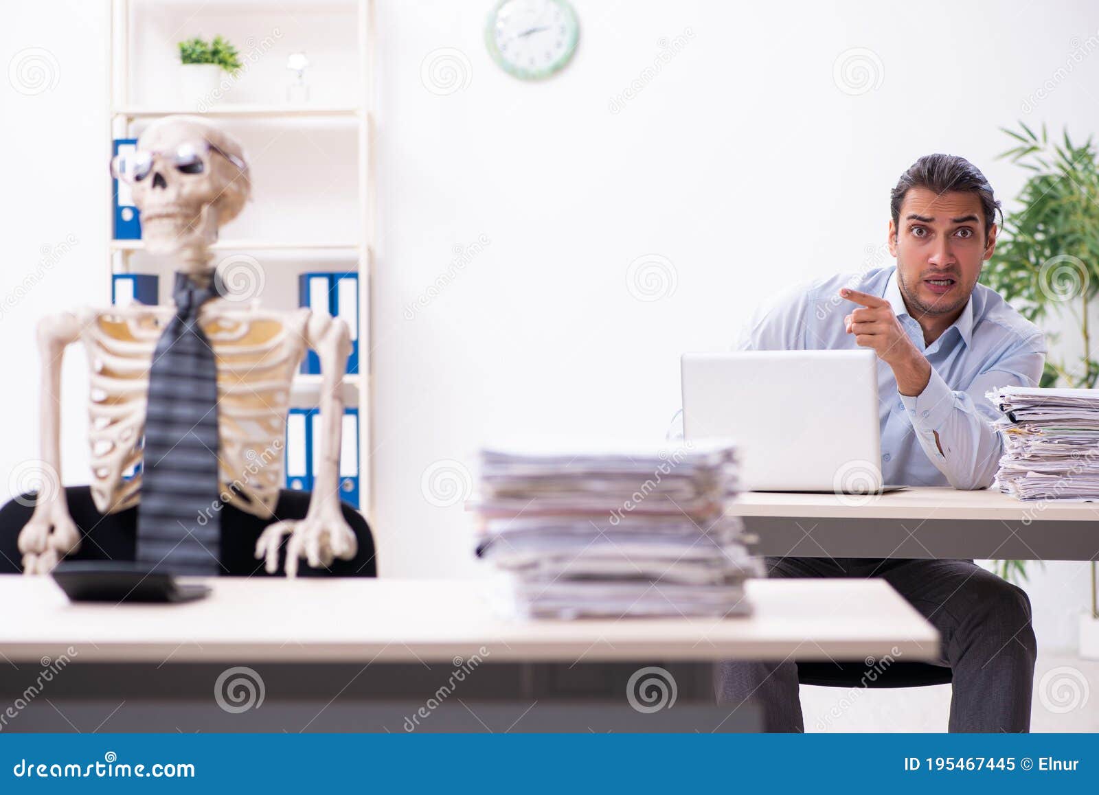 Young Male Employee and Skeleton in the Office Stock Image - Image of ...