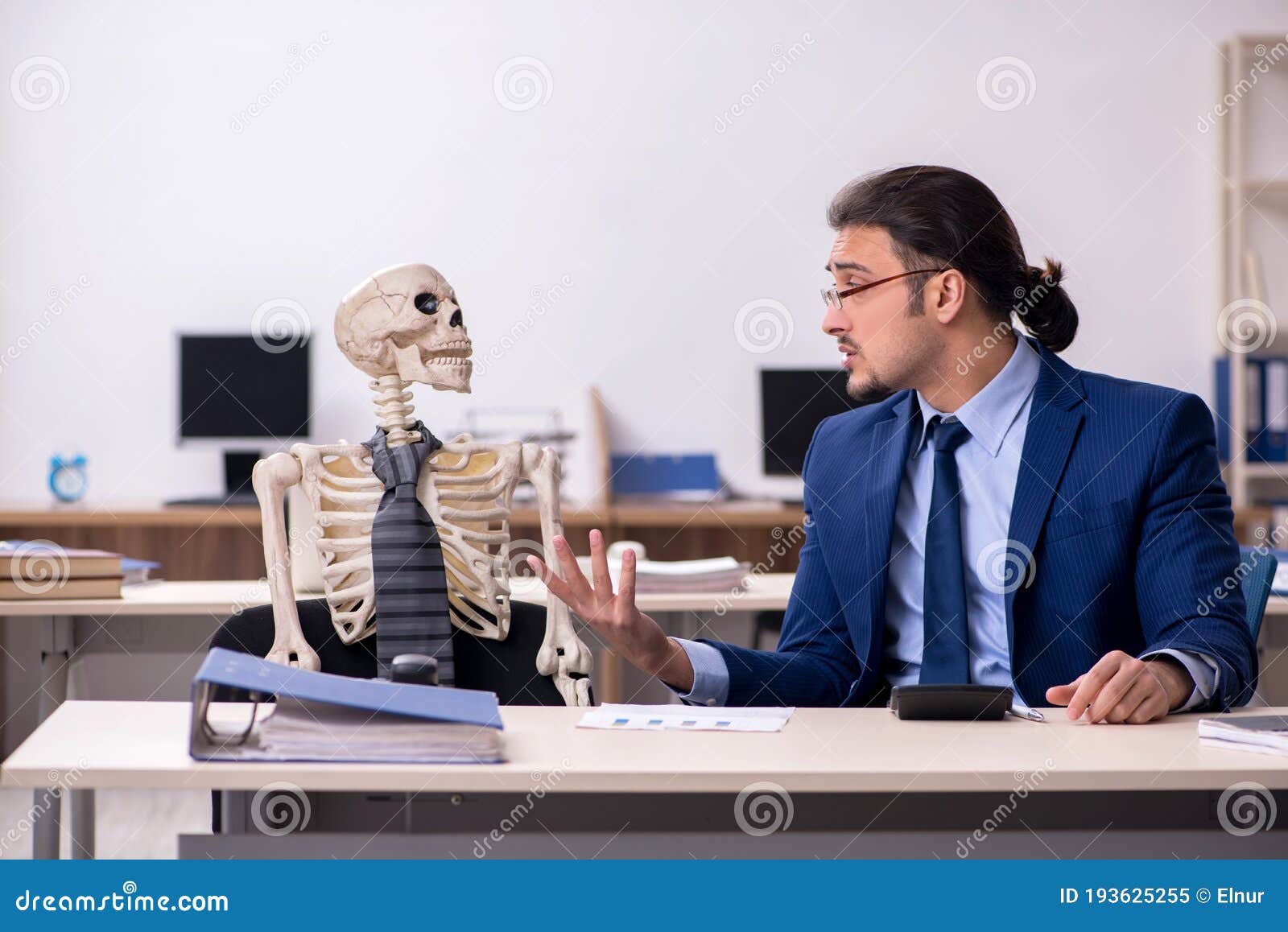 Young Male Employee with Skeletons in the Office Stock Image - Image of ...