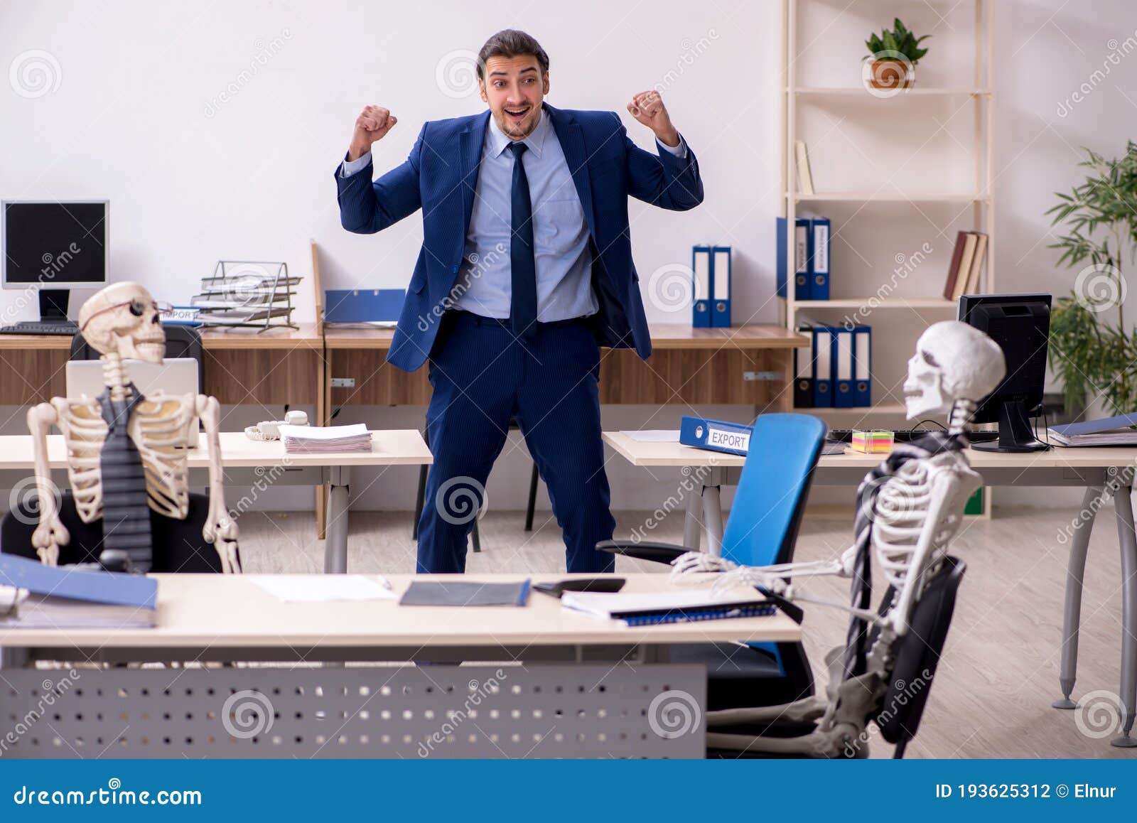 Young Male Employee with Skeletons in the Office Stock Photo - Image of ...