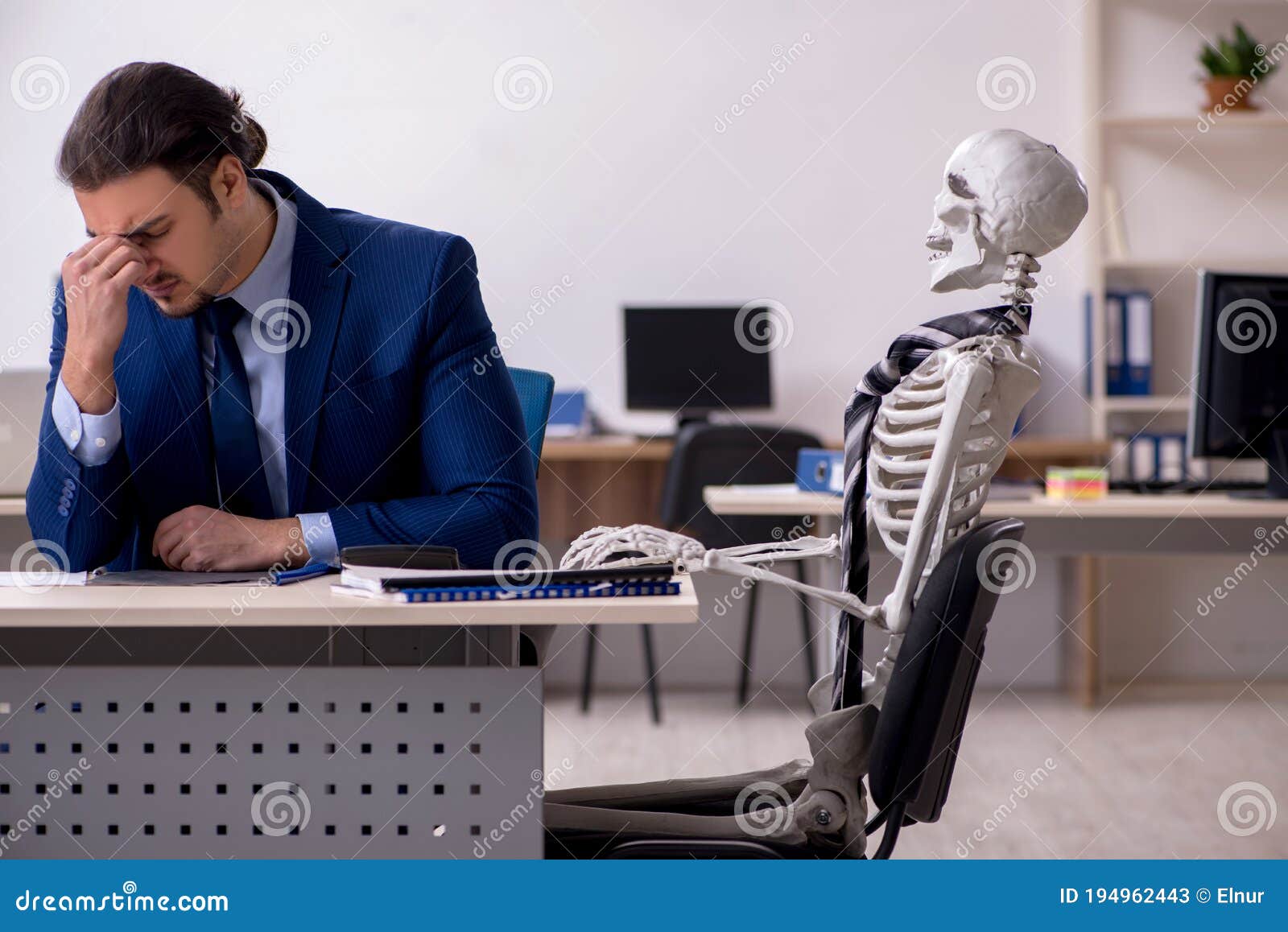Young Male Employee with Skeletons in the Office Stock Image - Image of ...