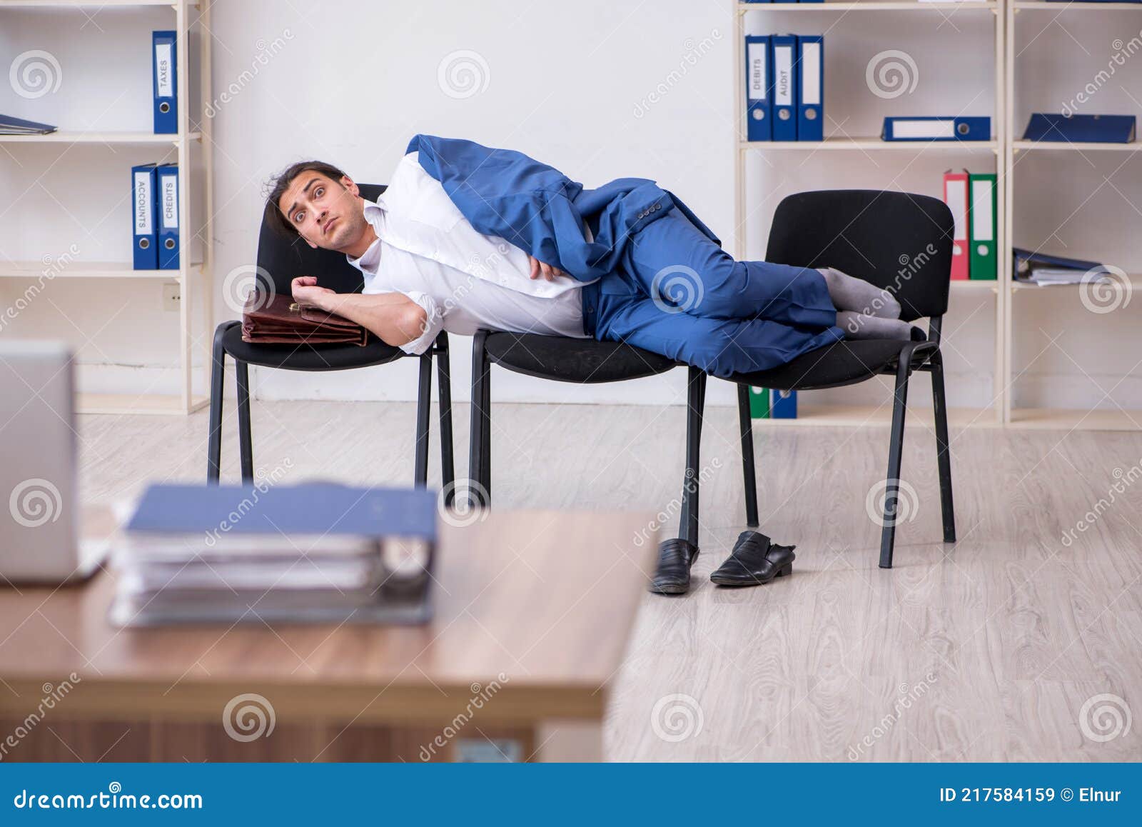 Young Male Employee Sleeping in the Office on Chairs Stock Image ...