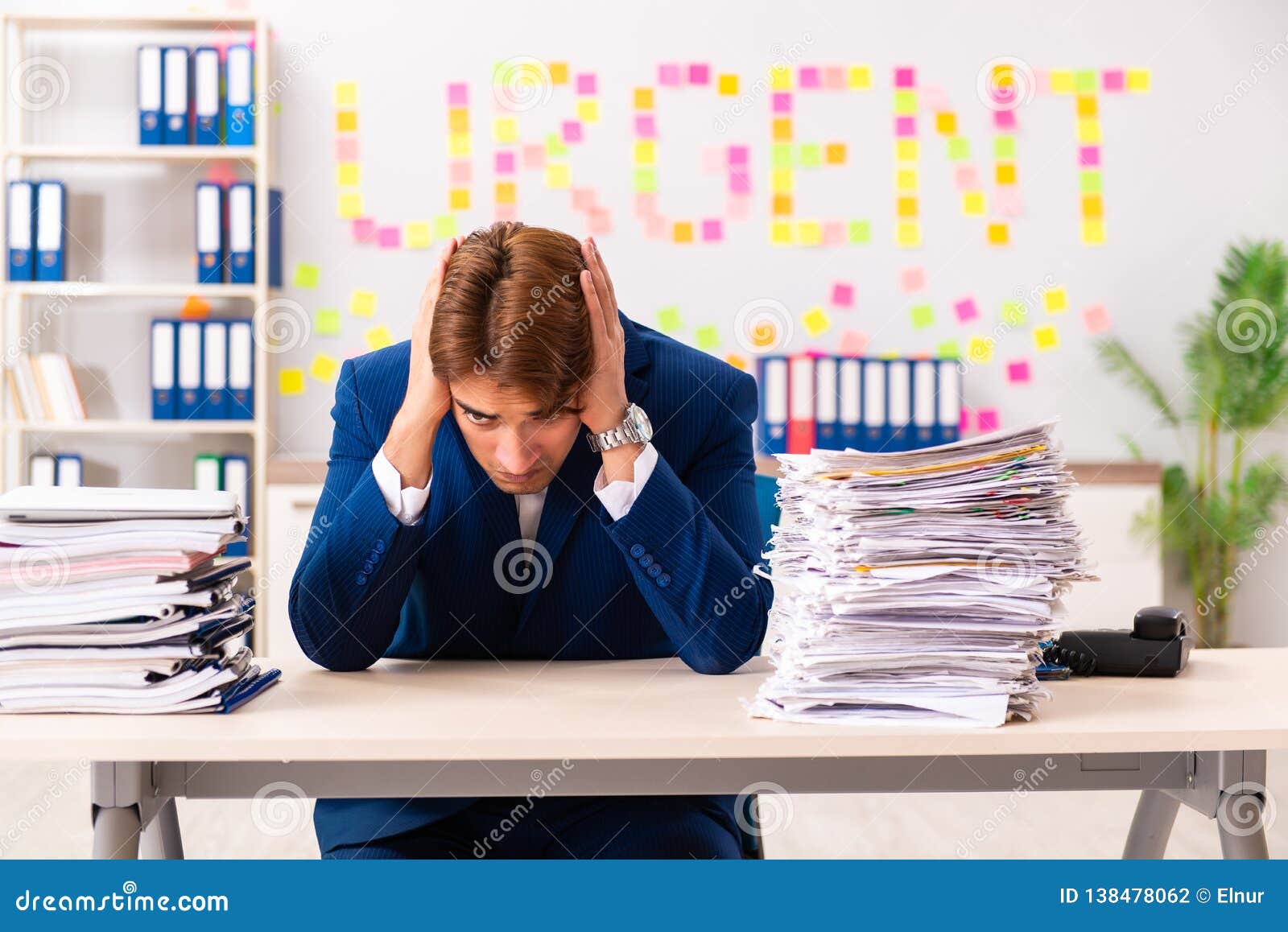 The Young Employee Suffering from Excessive Work Stock Photo - Image of ...