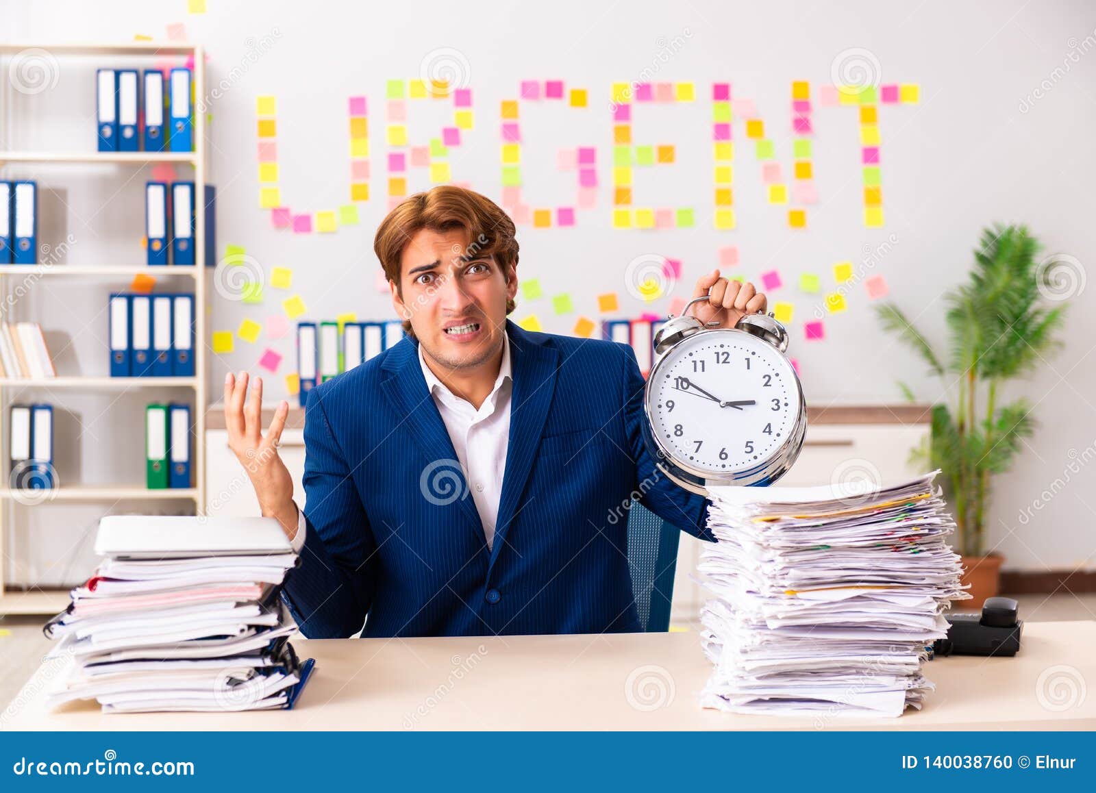 The Young Employee Suffering from Excessive Work Stock Photo - Image of ...