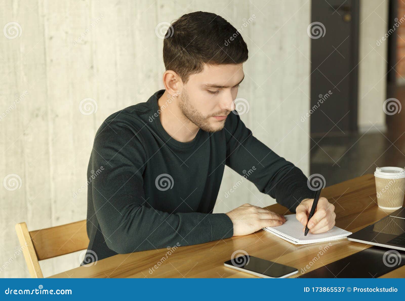 Young Employee Taking Notes Sitting in Modern Office Stock Image ...