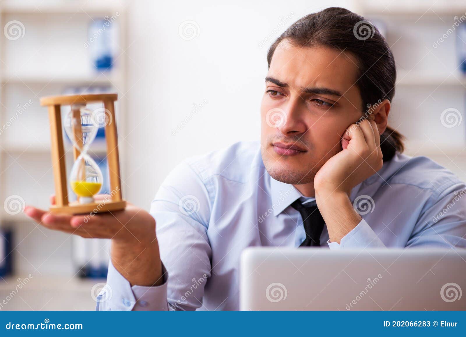 Young Male Employee in Time Management Concept Stock Image - Image of ...