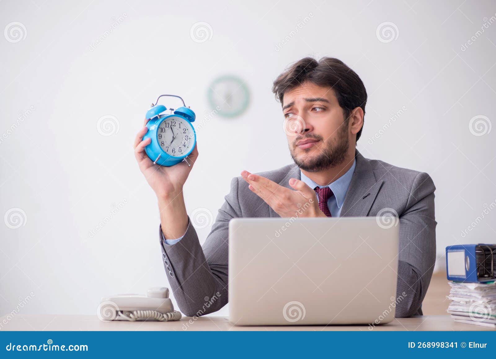 Young Male Employee in Time Management Concept Stock Image - Image of ...