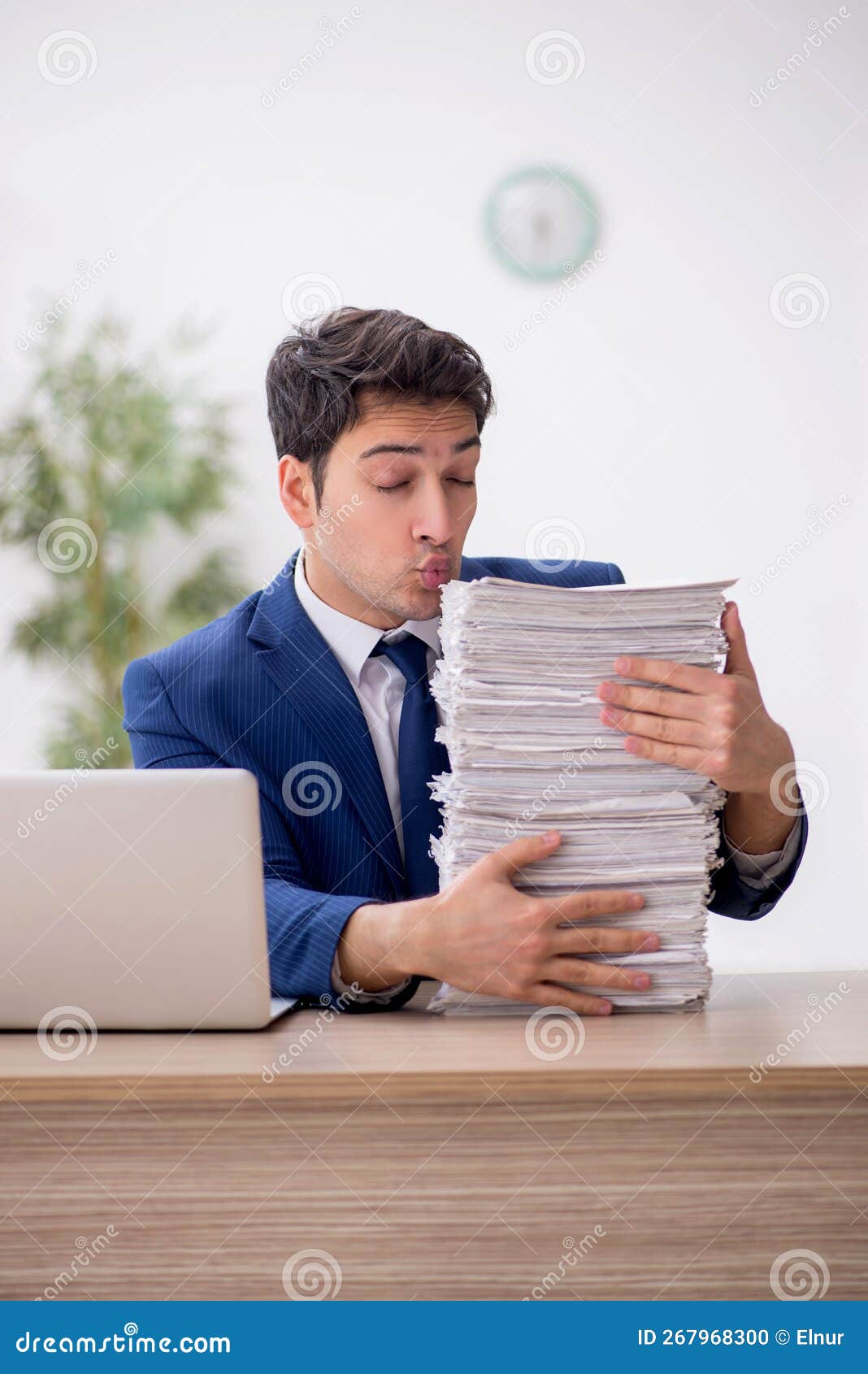 Young Male Employee and Too Much Work in the Office Stock Photo - Image ...