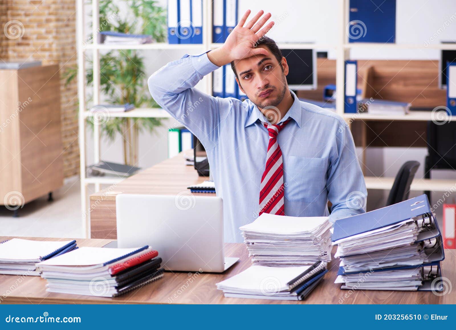 Young Male Employee Unhappy with Excessive Work Stock Photo - Image of ...