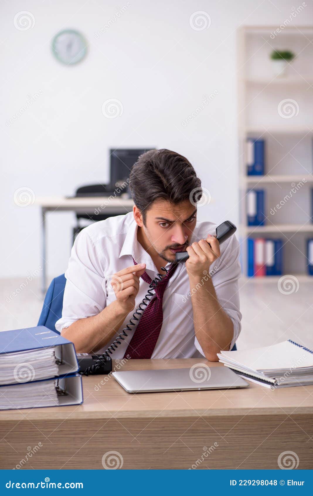 Young Male Employee Unhappy with Excessive Work in the Office Stock ...