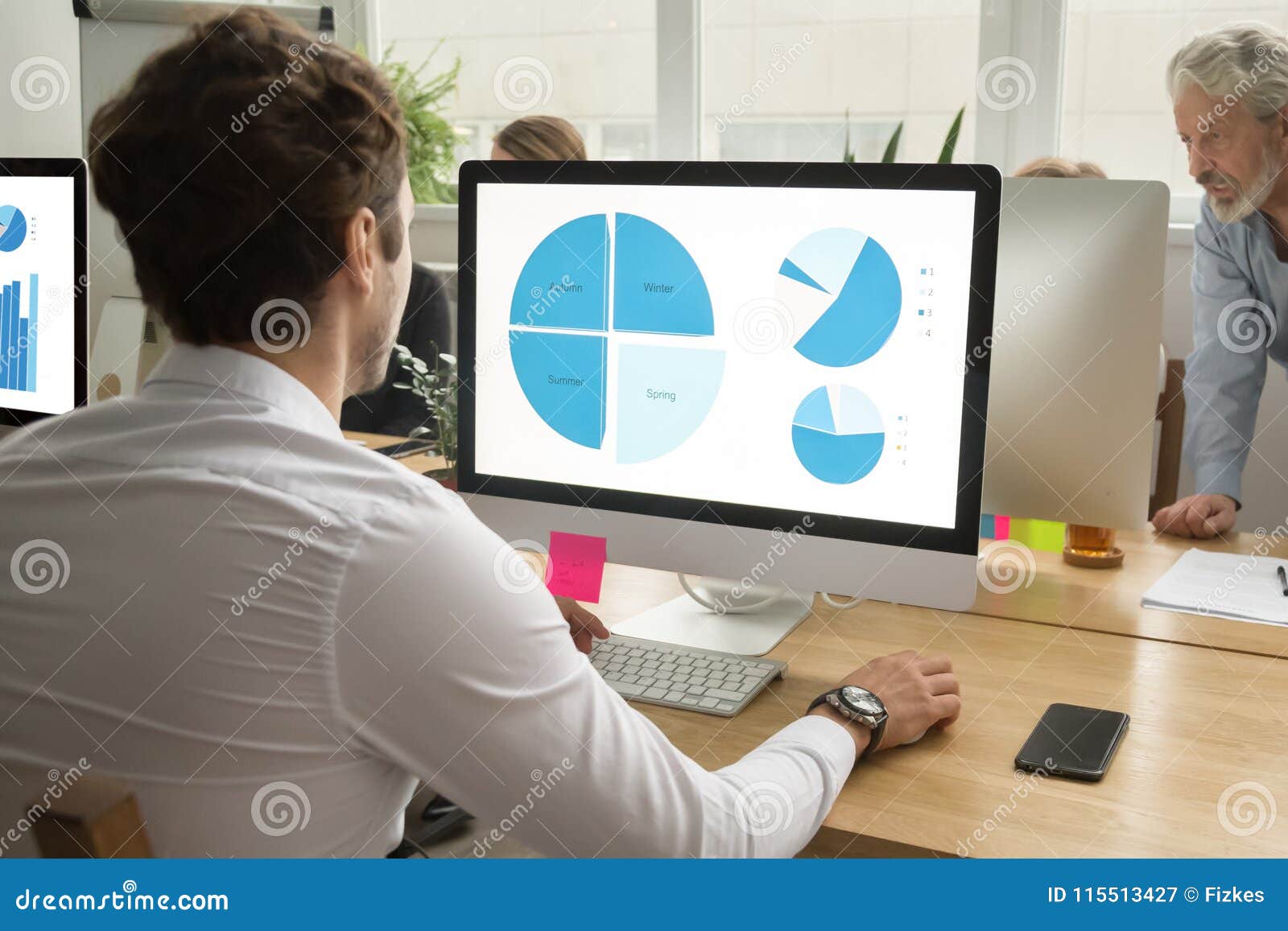 Young Employee Using Computer Analyzing Data, Statistics Analysi Stock ...