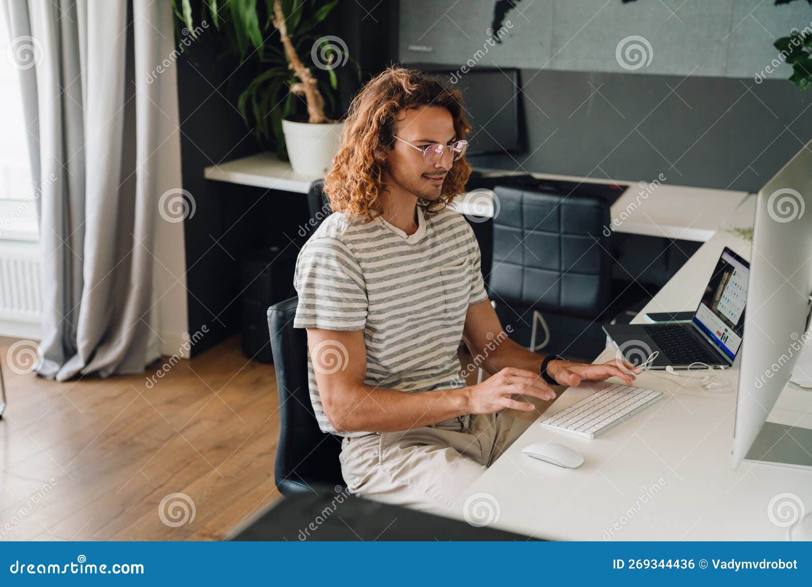 Young Employee Working on Desktop Computer in Office Stock Photo ...