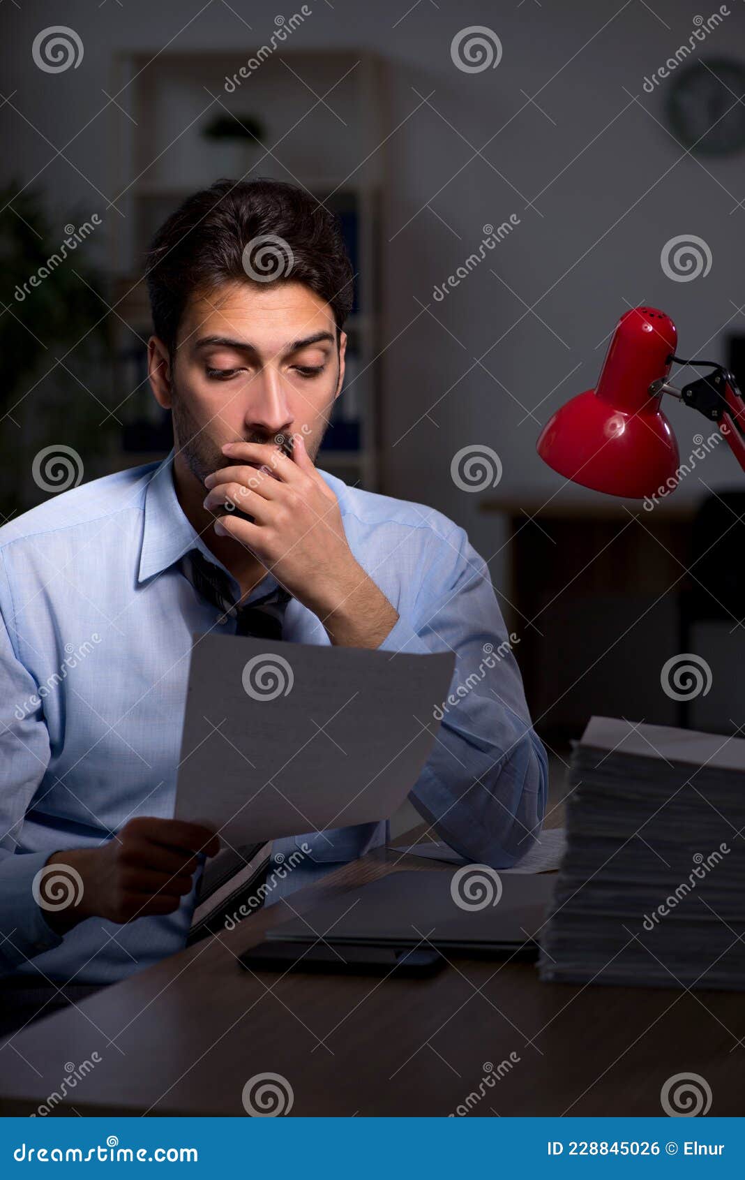 Young Male Employee Working Late in the Office Stock Photo - Image of ...