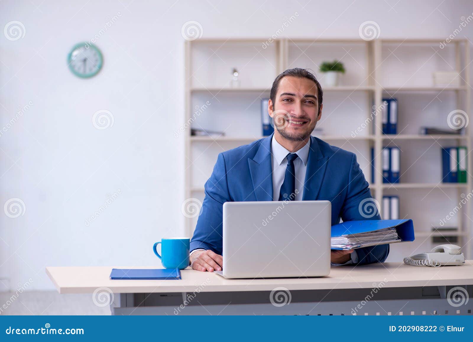 Young Male Employee Working at Workplace Stock Photo - Image of ...