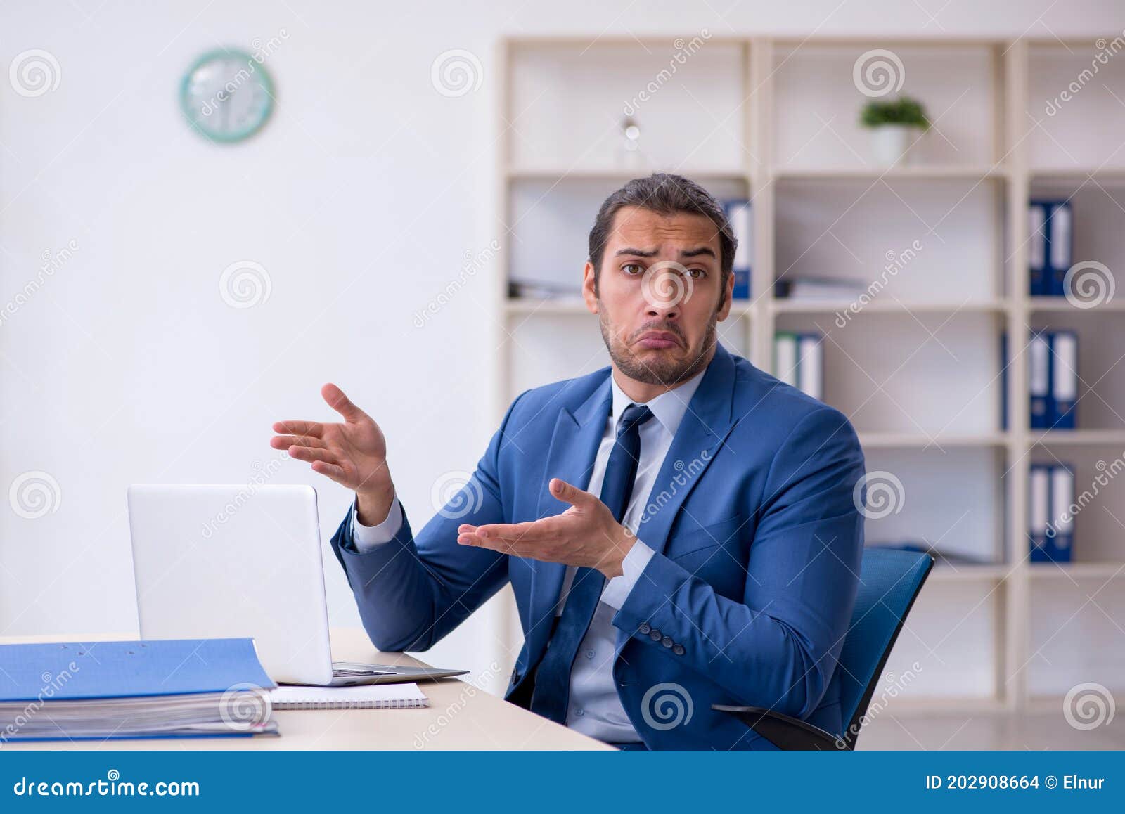 Young Male Employee Working at Workplace Stock Photo - Image of ...