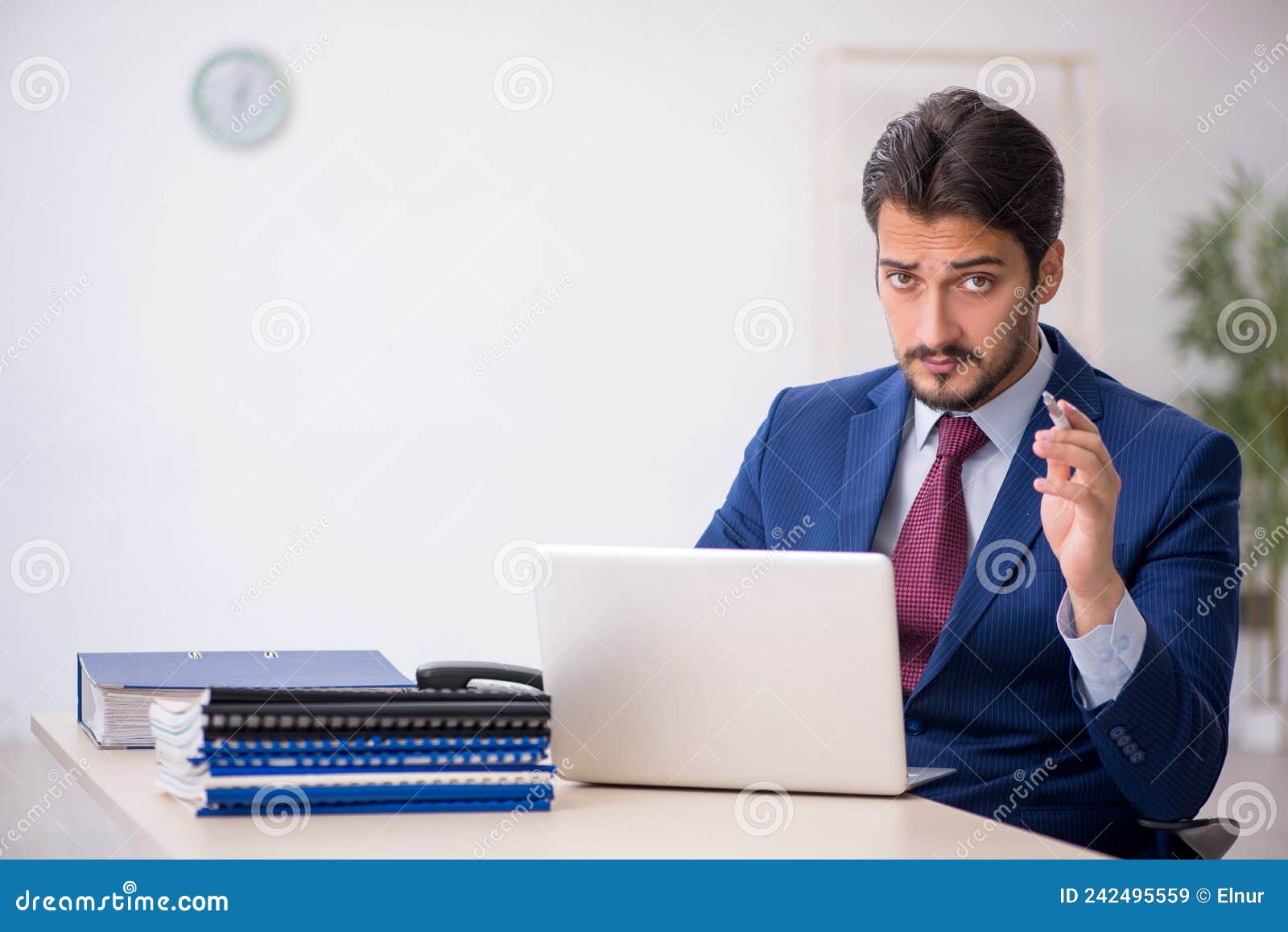 Young Male Employee Working at Workplace Stock Image - Image of ...