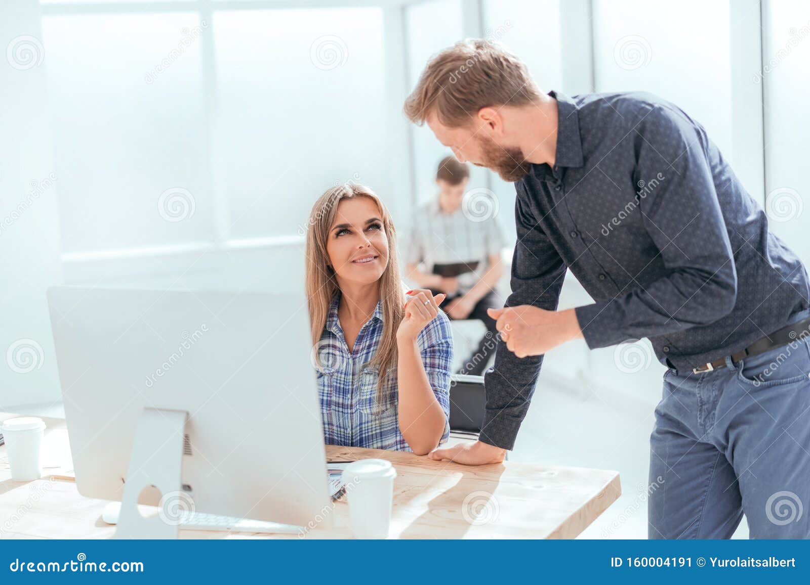 Young Employees Discussing Work Issues in the Workplace Stock Image ...
