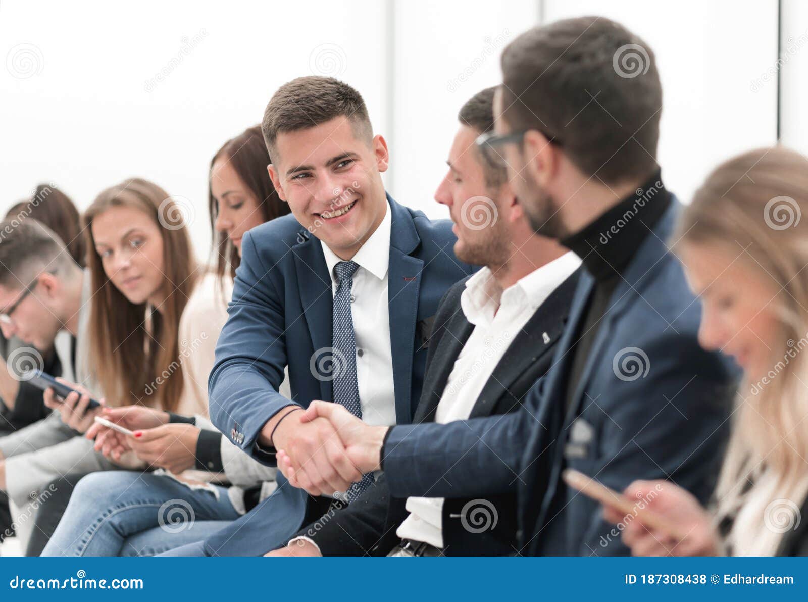 Young Employees Greeting Each Other with a Handshake Stock Photo ...