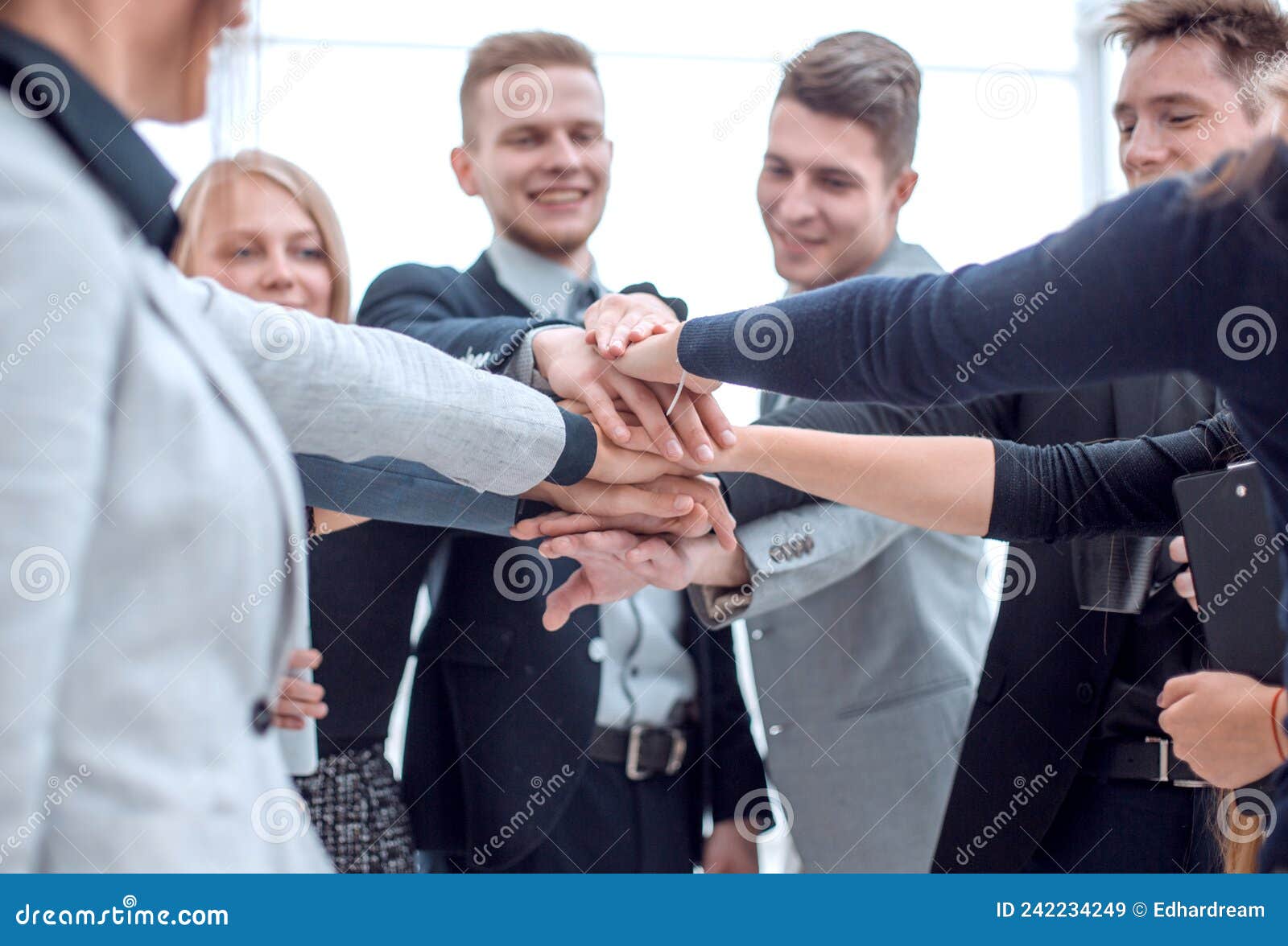Young Employees Making a Stack Out of Their Hands Stock Image - Image ...