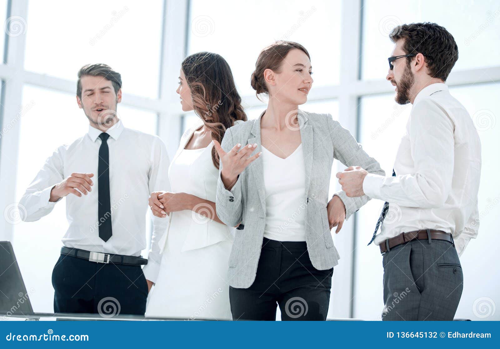 Young Employees Talk in the Office Stock Photo - Image of occupation ...