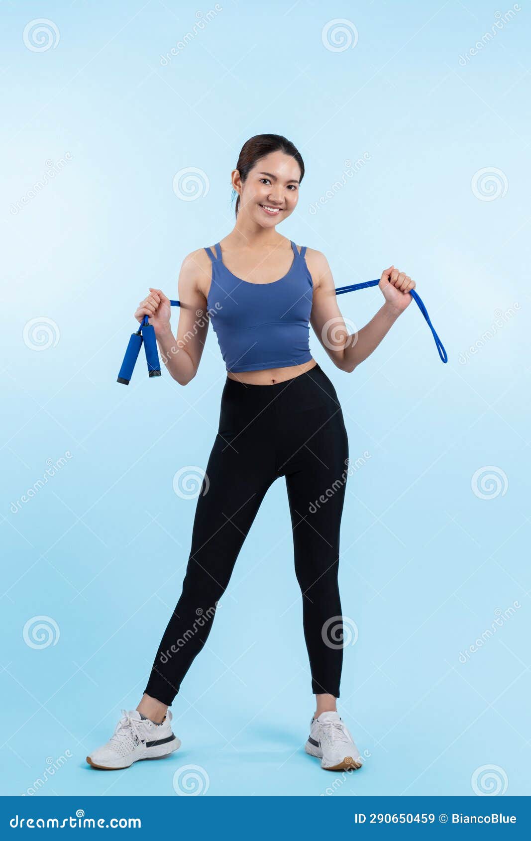 Young Energetic Asian Woman In Sportswear With Jumping Rope Vigorous